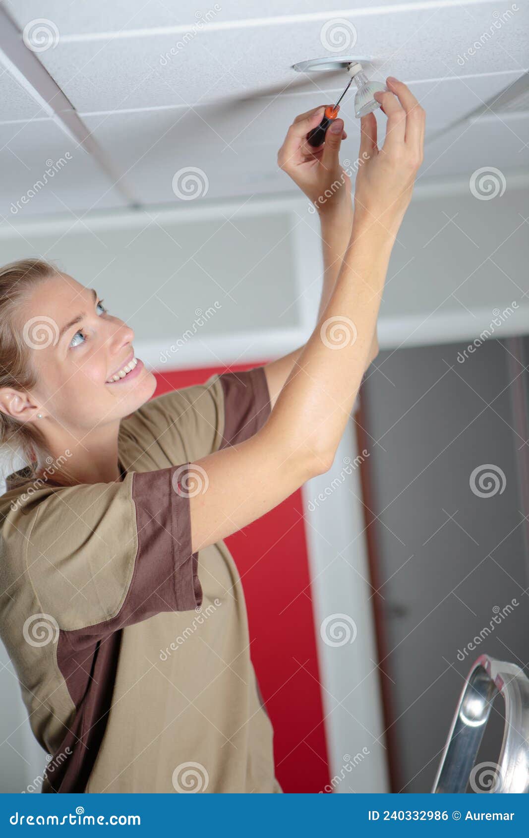 Female Worker Replacing Bulb Stock Photo - Image of energy, labor ...
