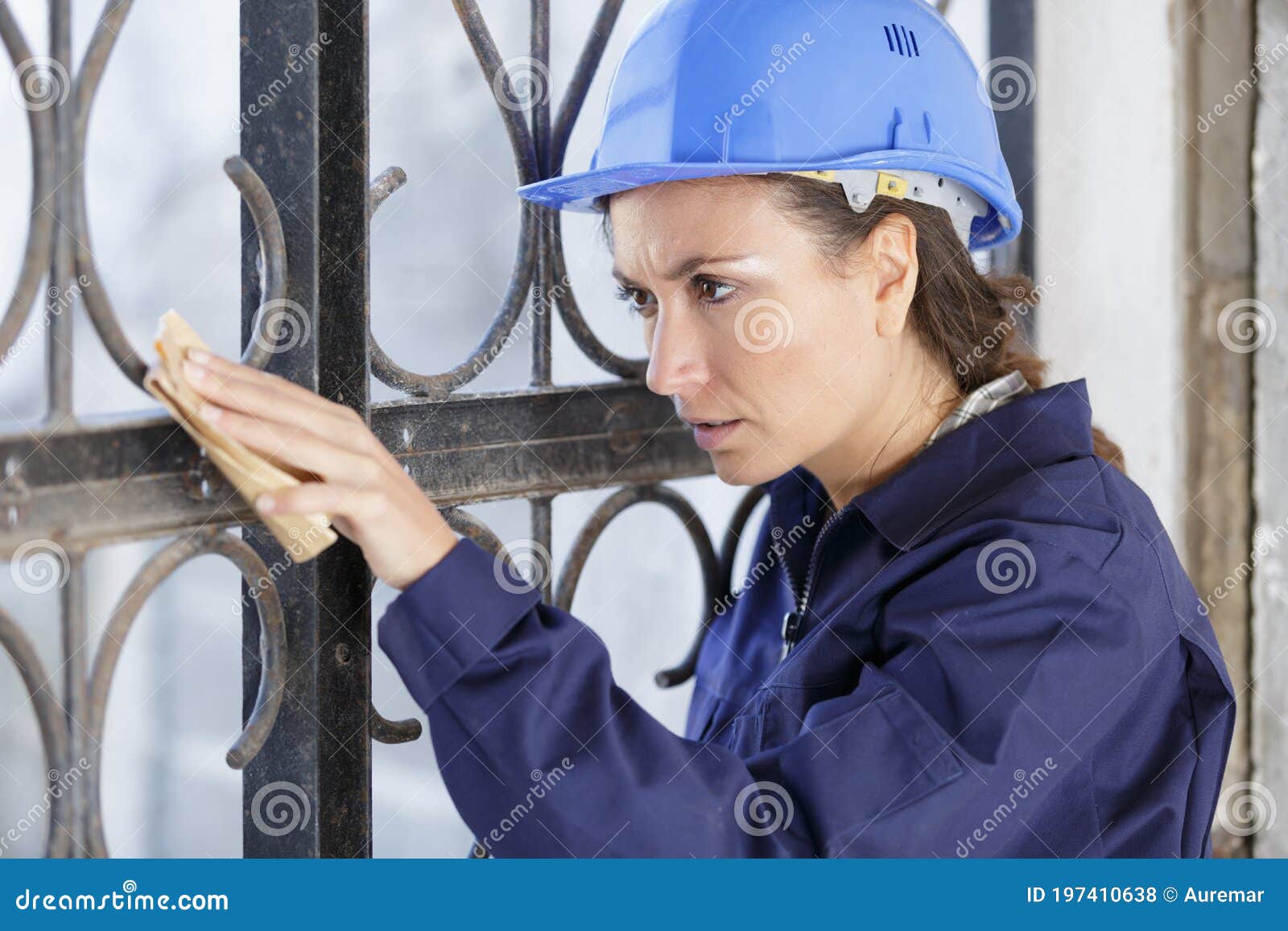 Female Worker Sanding Frame Stock Photo - Image of plasterwork, hands ...
