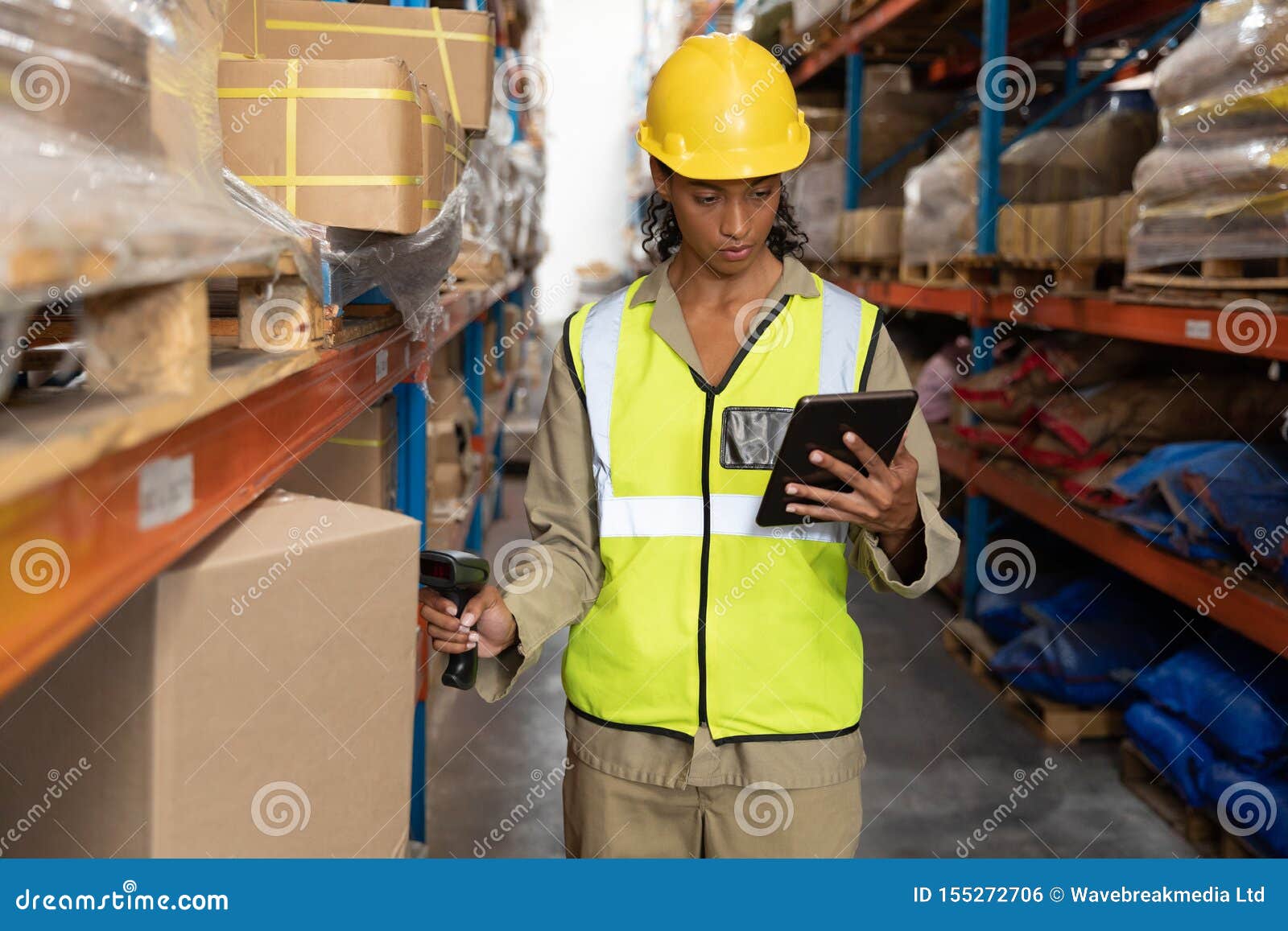 Female Worker Scanning Package with Barcode Scanner while Using Digital ...