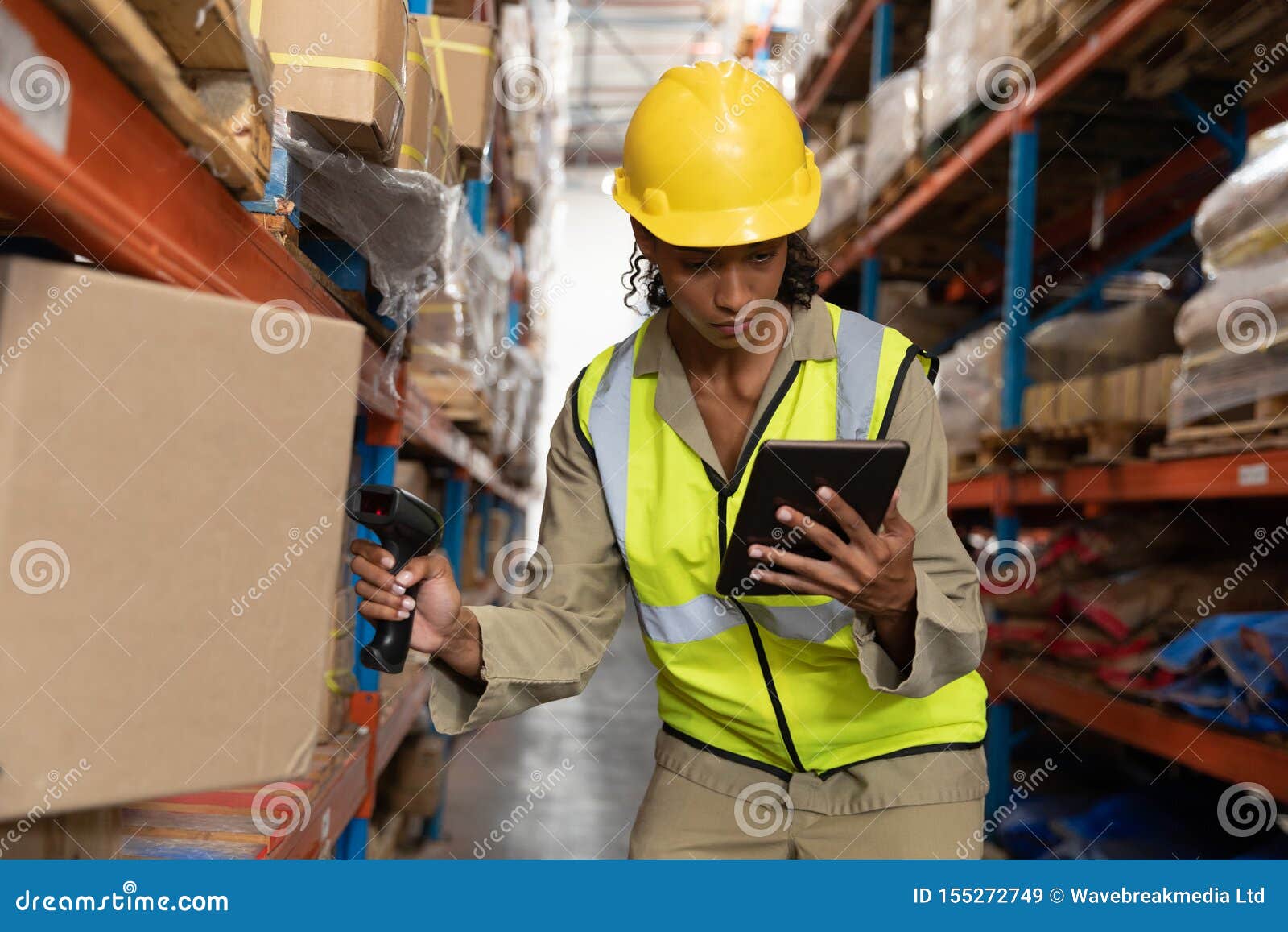 Female Worker Scanning Package with Barcode Scanner while Using Digital ...