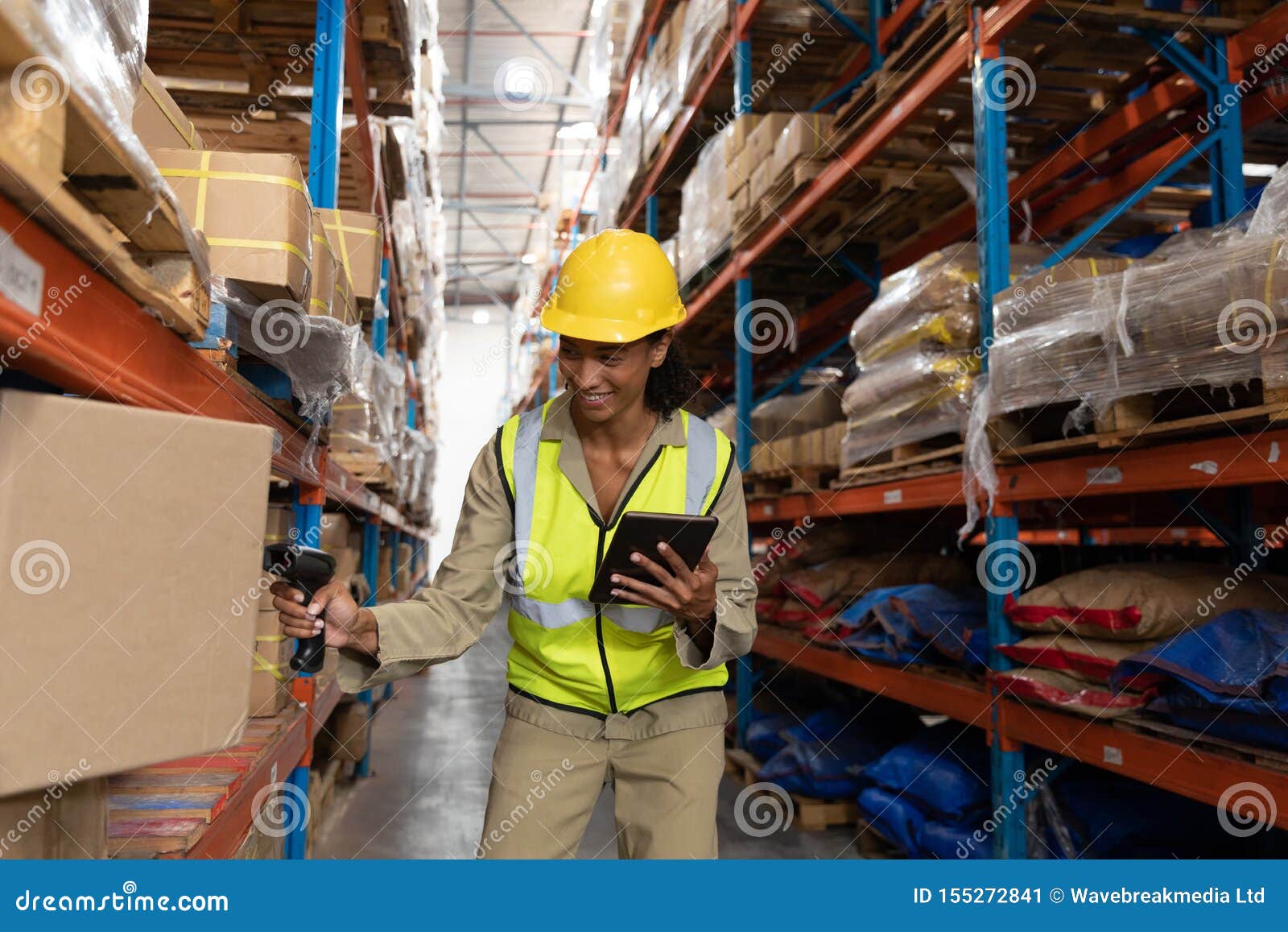 Female Worker Scanning Package with Barcode Scanner while Using Digital ...