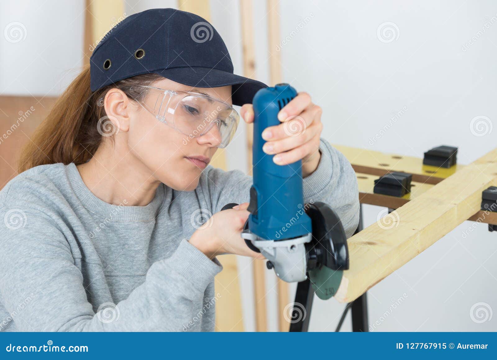 Female Worker Using Angle Grinder Stock Image - Image of young ...