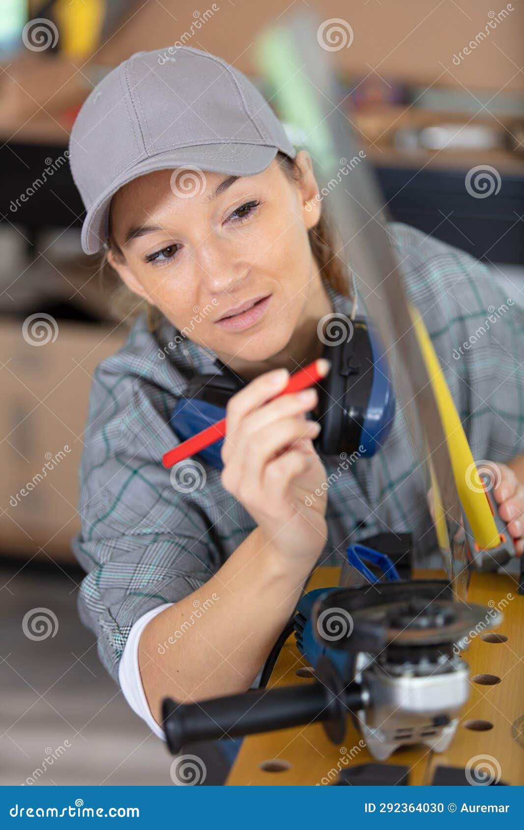 Female Worker Using Angle Grinder in Workshop Stock Photo - Image of ...
