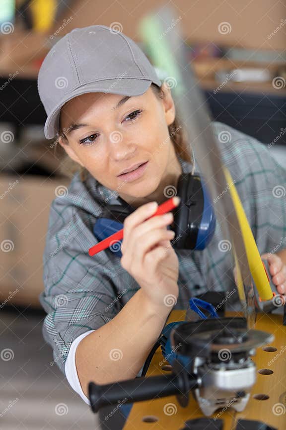 Female Worker Using Angle Grinder in Workshop Stock Photo - Image of ...