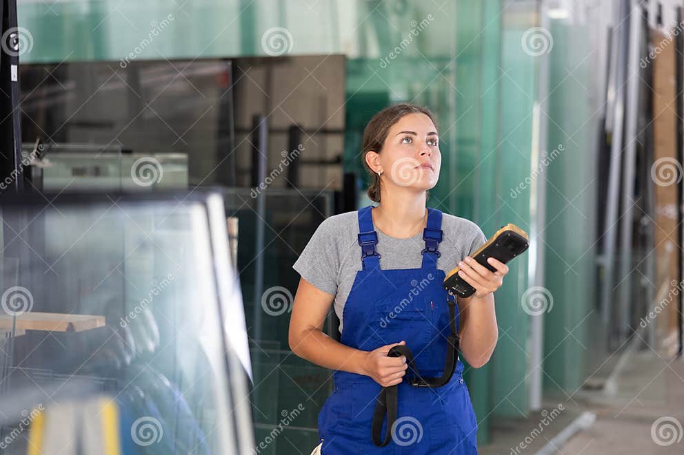 Female Worker Using Control Panel and Lifting Mechanism Controls ...