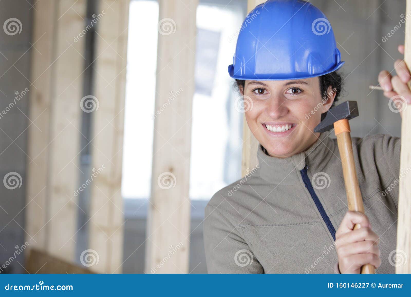 Female worker using hammer stock image. Image of drilling - 160146227