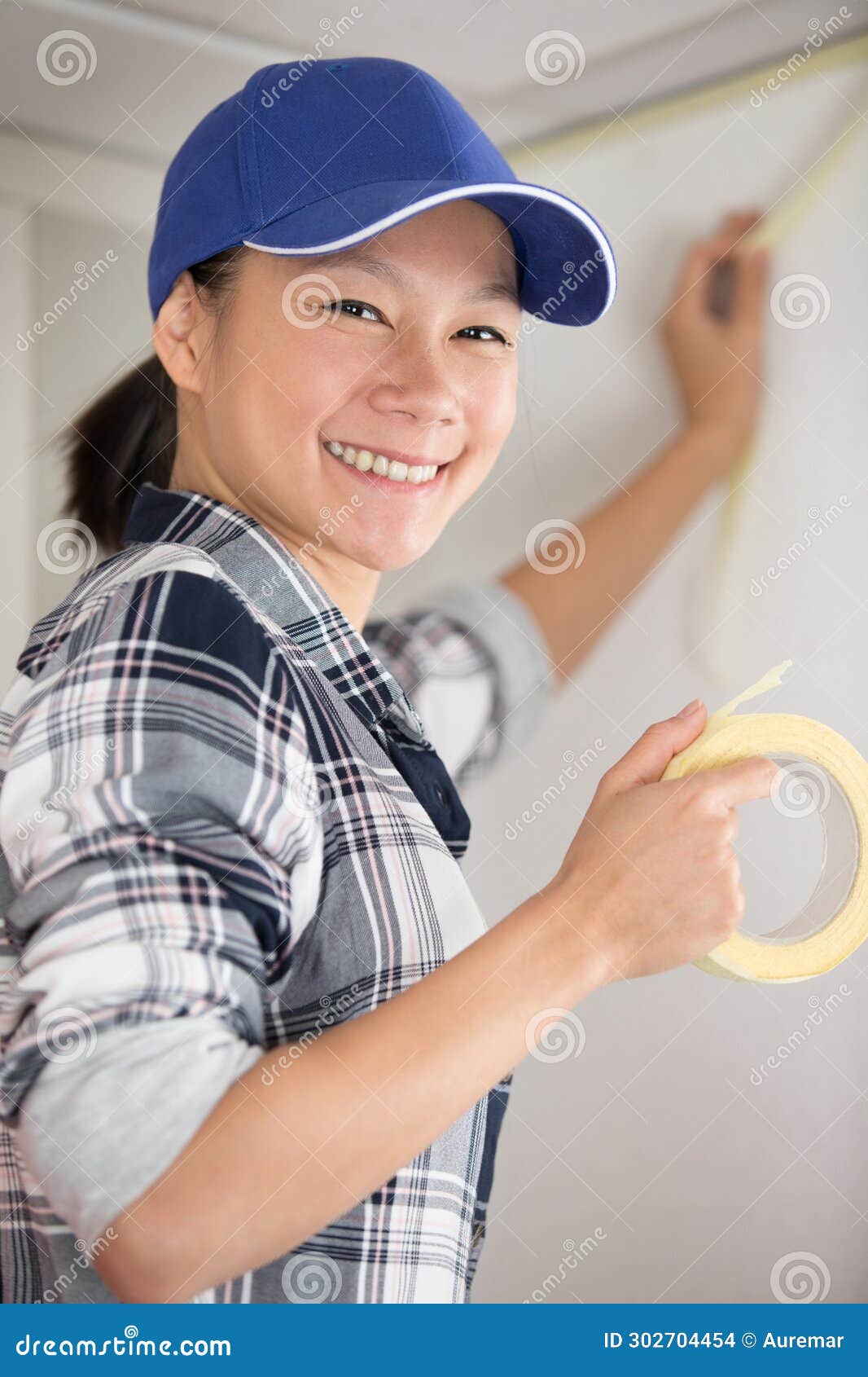 Female Worker Using Masking Tape To Paint Wall Stock Photo - Image of ...