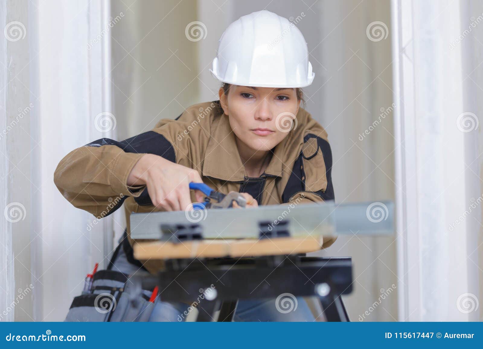 Female Worker Using Pliers Working on Workbench Stock Image - Image of ...