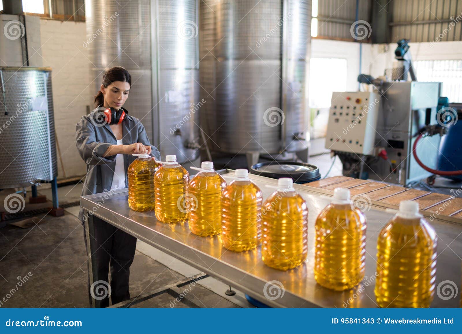 Female Worker Working in Oil Factory Stock Image - Image of people ...