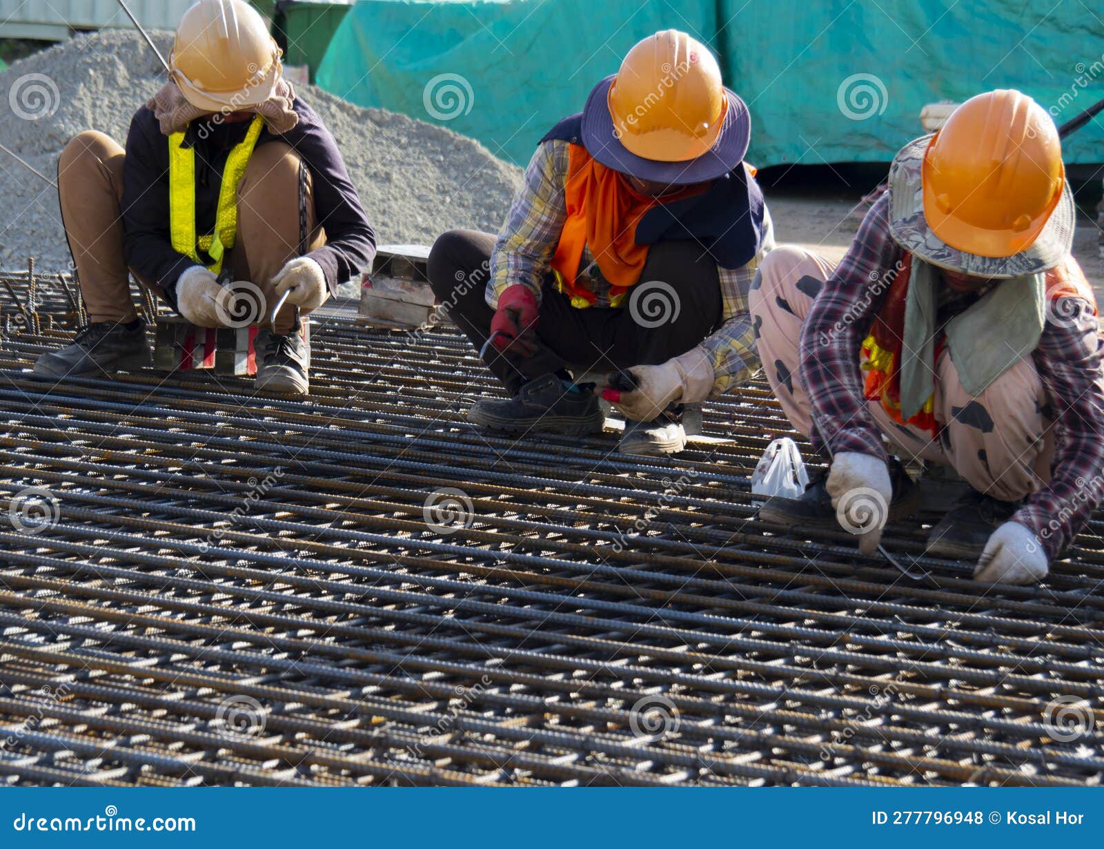 Female Workers Tie Rebar for Structural Work. Contraction in Progress ...