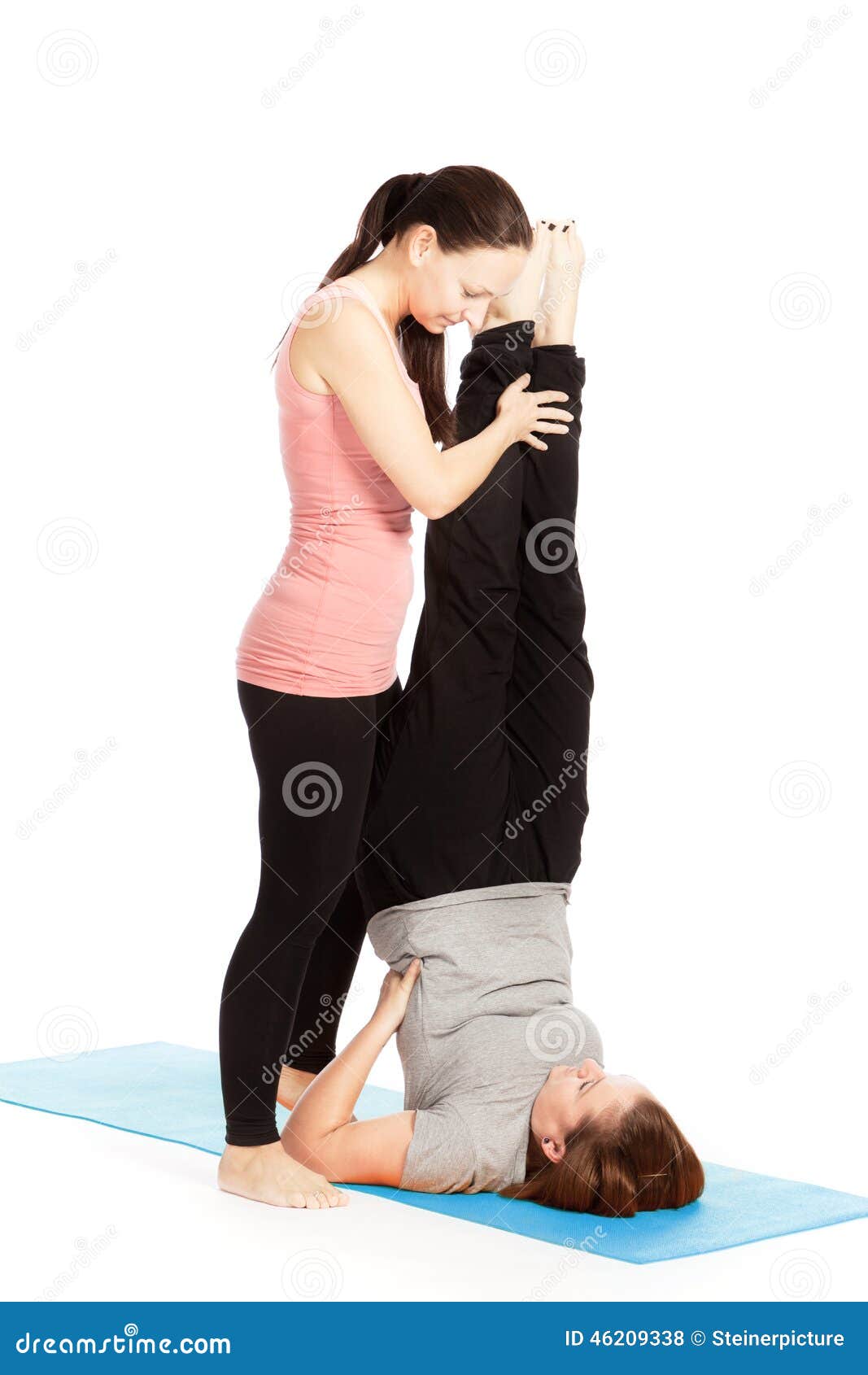 Female Yoga Teacher Provides Assistance Stock Photo - Image of studio ...
