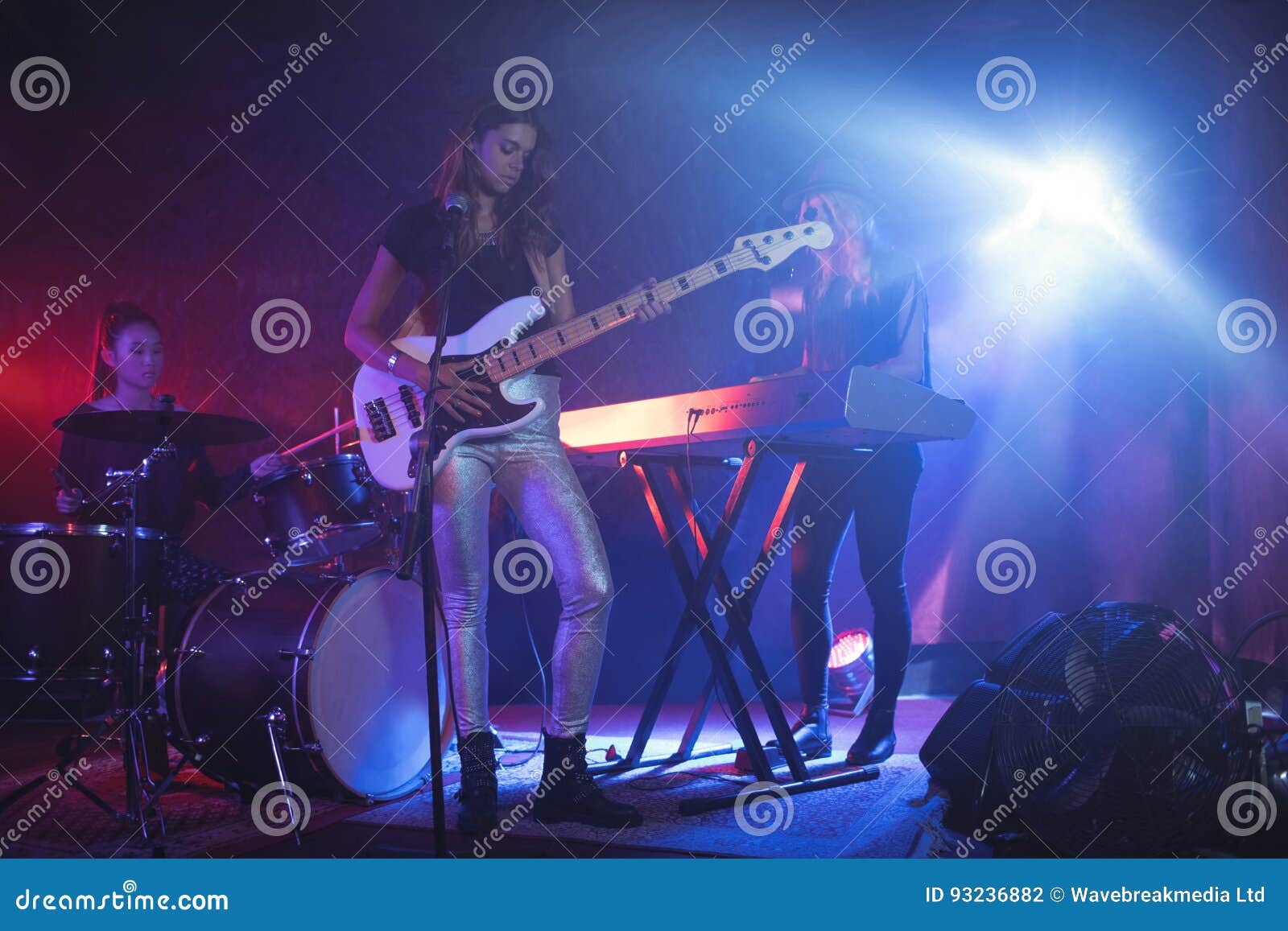 Females Performing on Illuminated Stage in Nightclub Stock Photo ...