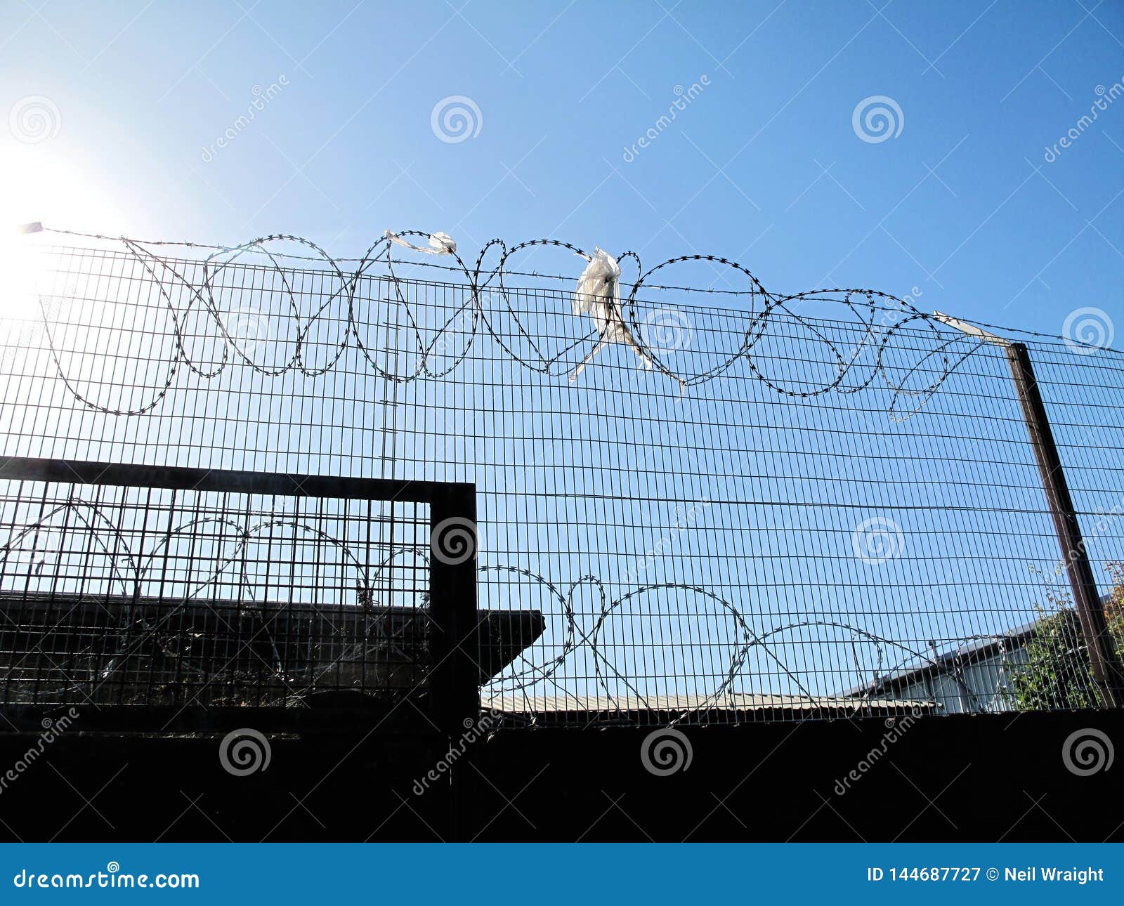 Barbed & Razor Wire Security Protection on Fence Stock Image - Image of ...