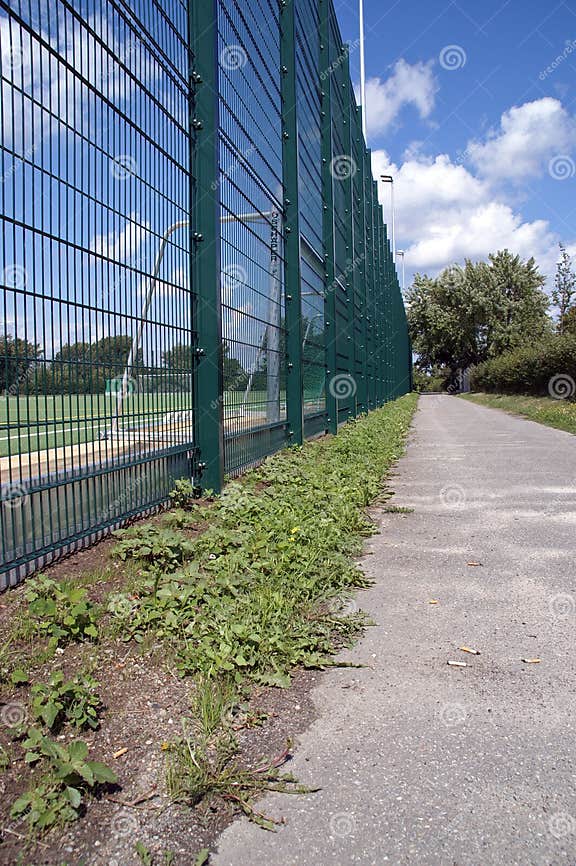 Fence around soccer field stock image. Image of obstacle - 1097533