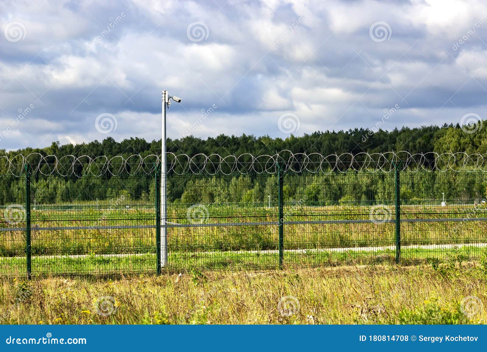 Fence, Barbed Wire and Video Camera. Obstruction and Surveillance ...