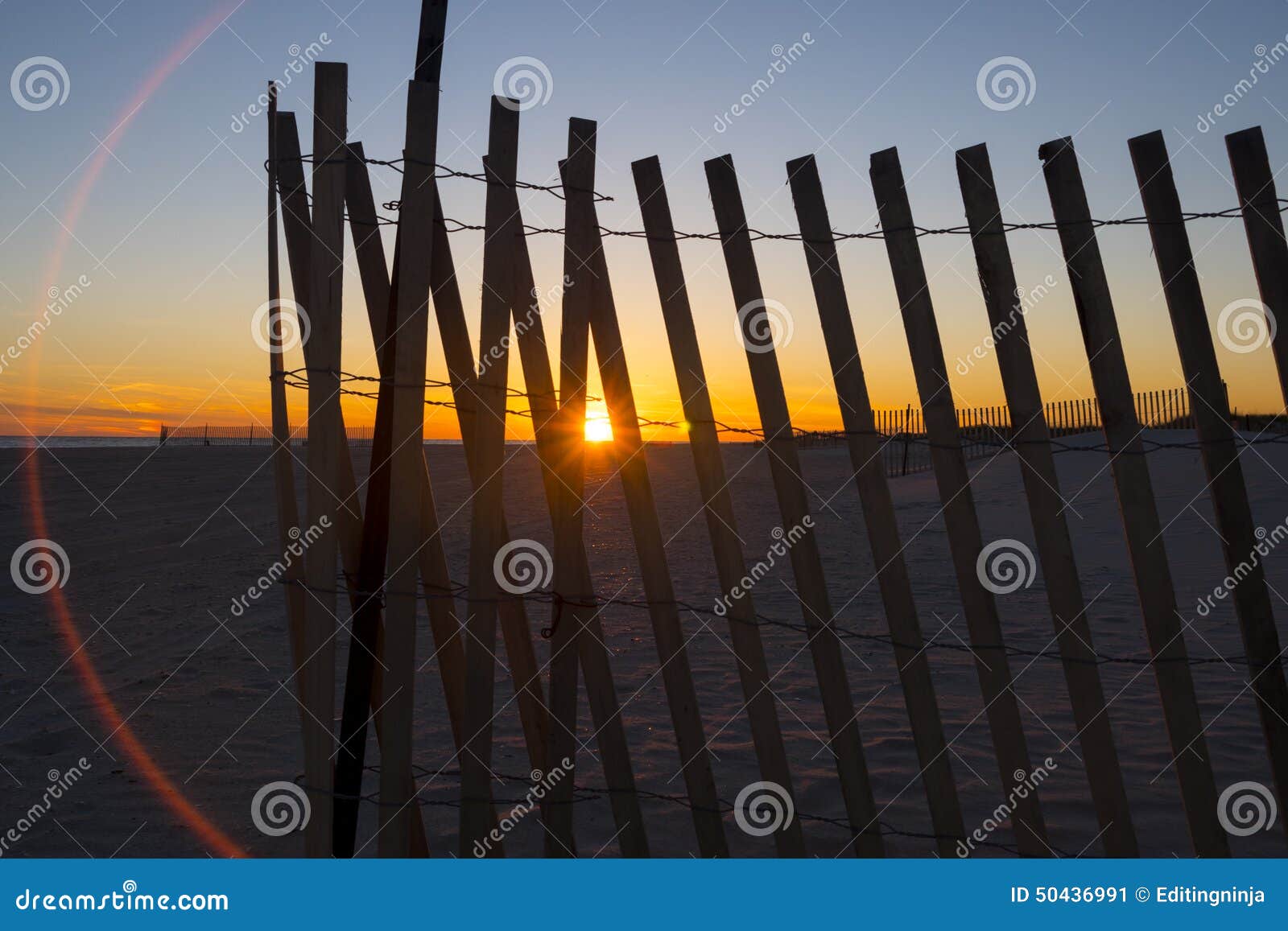 Fence on Beach during Sunset. Stock Image - Image of sunset, flare ...