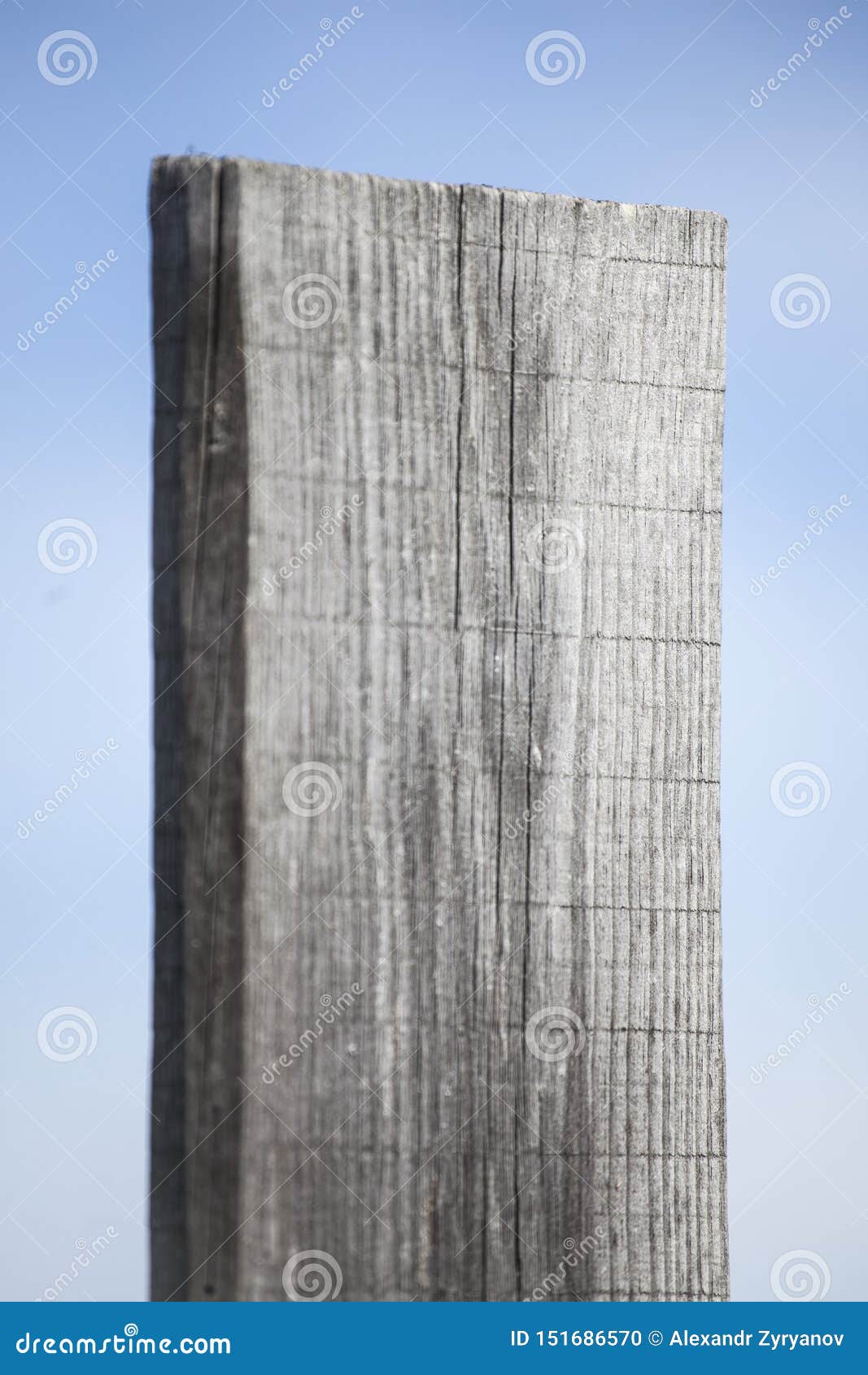 Fence Board Made of Sharp Wooden Stakes Against the Blue Sky Stock ...