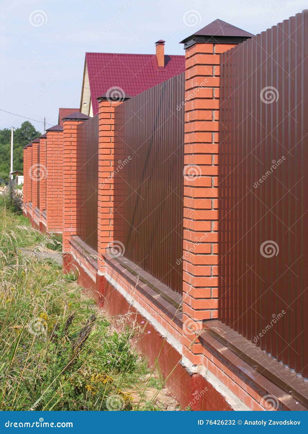 Fence with brick pillars stock photo. Image of grass - 76426232