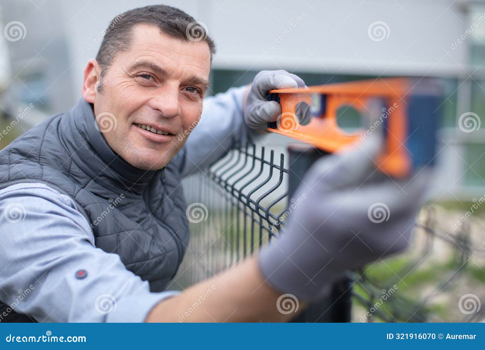Fence Construction - Worker Check Level Metal Post Stock Photo - Image ...