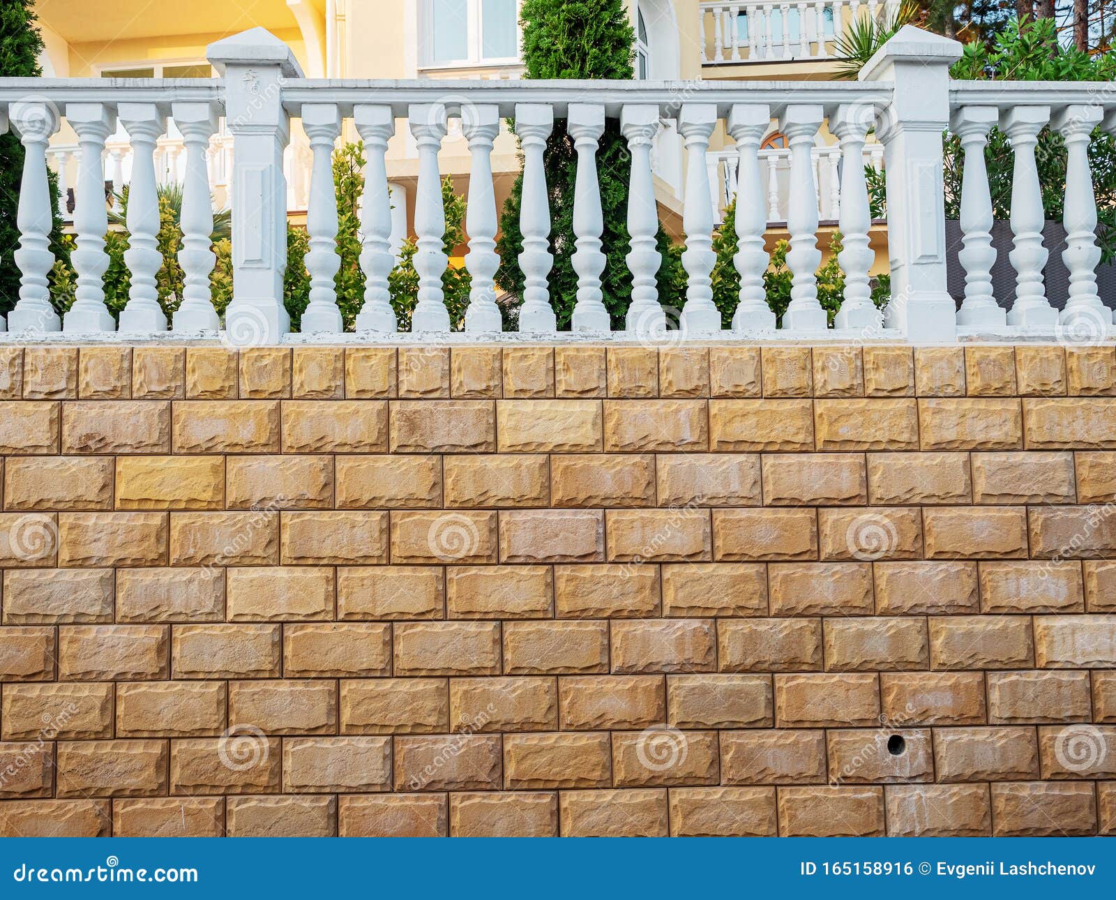 Beautiful Fence with Decorative Stone and White Balusters Stock Photo ...