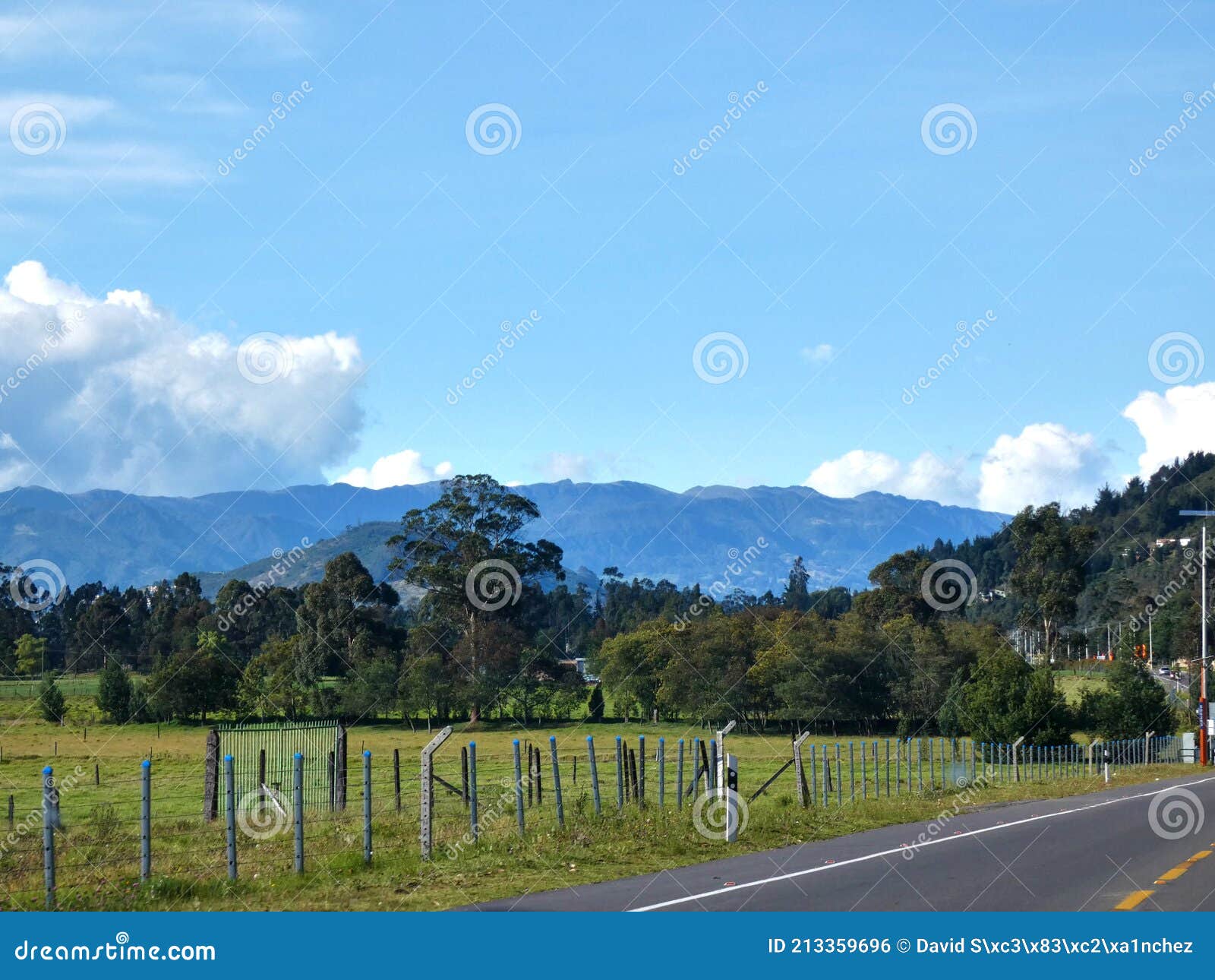 Fence Going Parallel To the Road Stock Photo - Image of hill ...