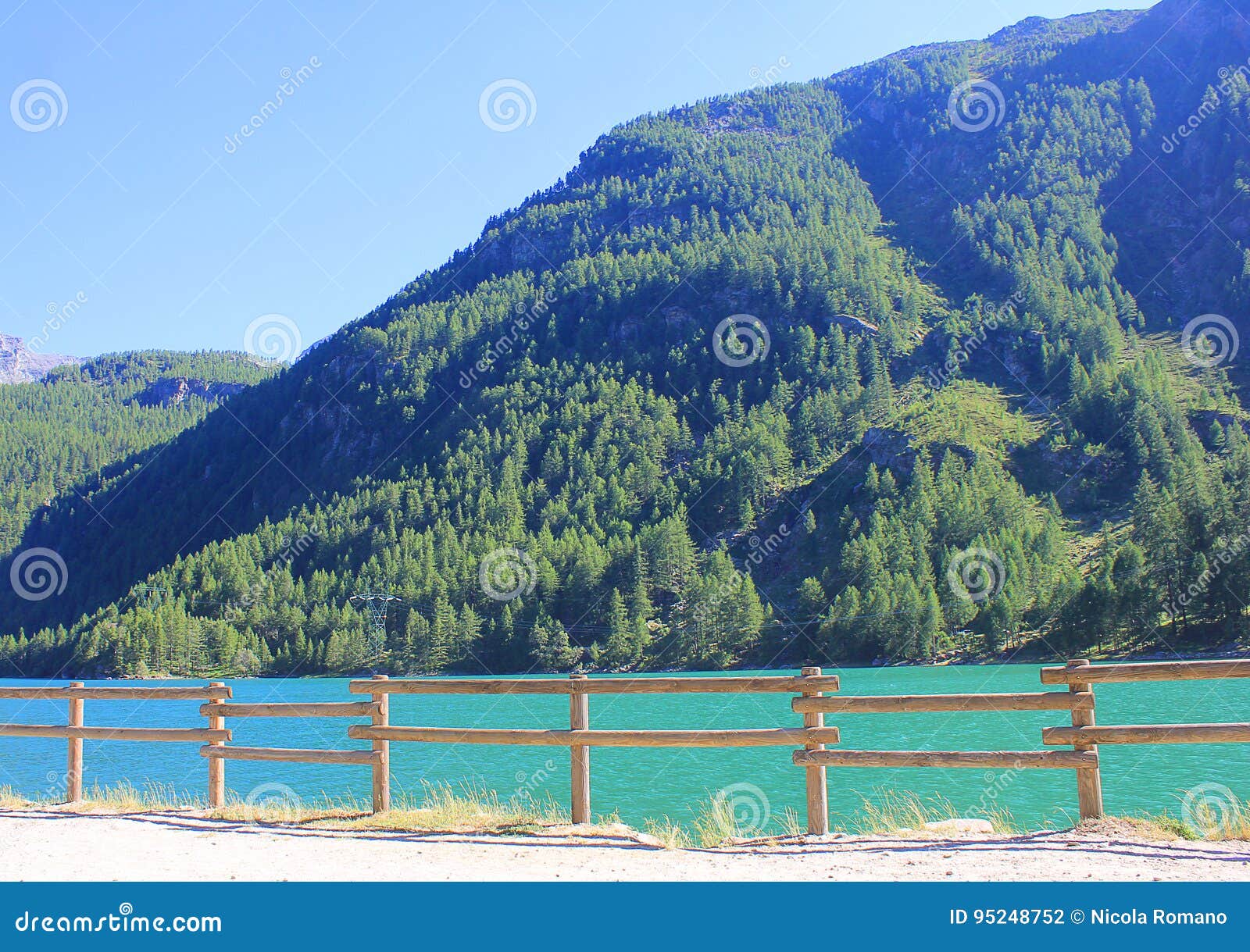 Fence in Front of an Alpine Lake Stock Photo - Image of lake, rocks ...
