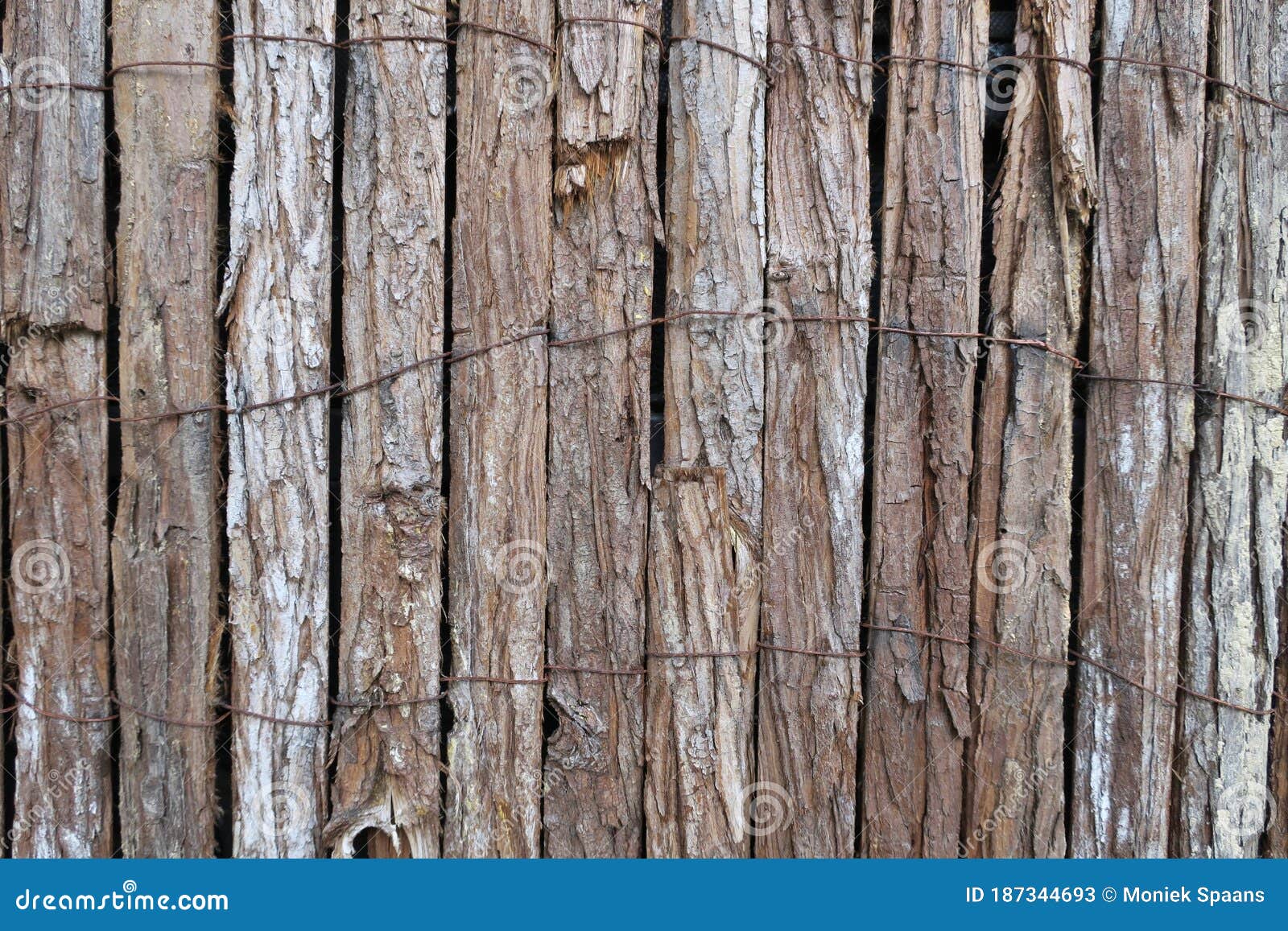 Fence Made of Pieces of Tree Bark and Iron Wire Stock Image - Image of ...