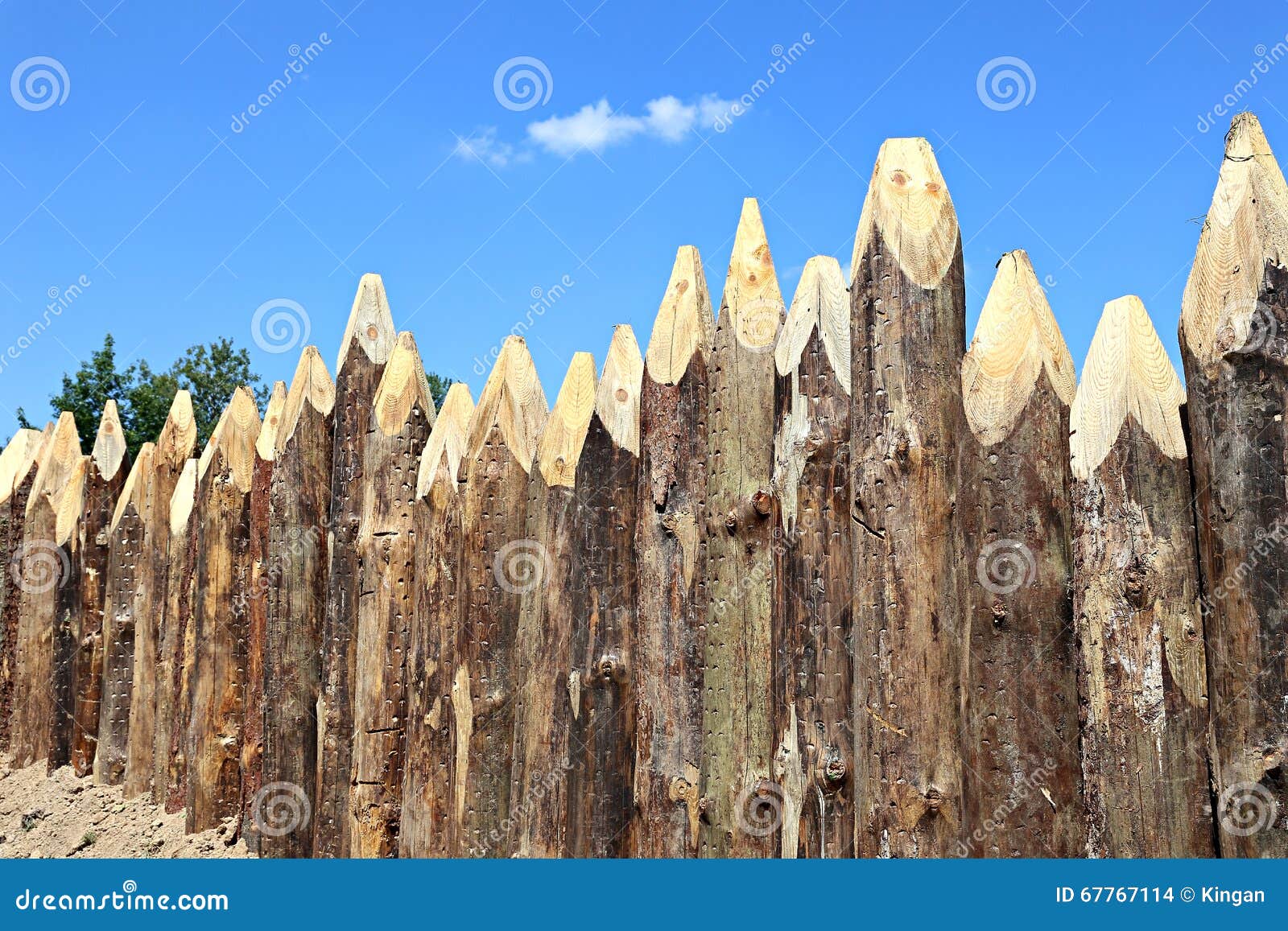 A Fence Made of Pointed Logs Stock Photo - Image of logs, strengthening ...