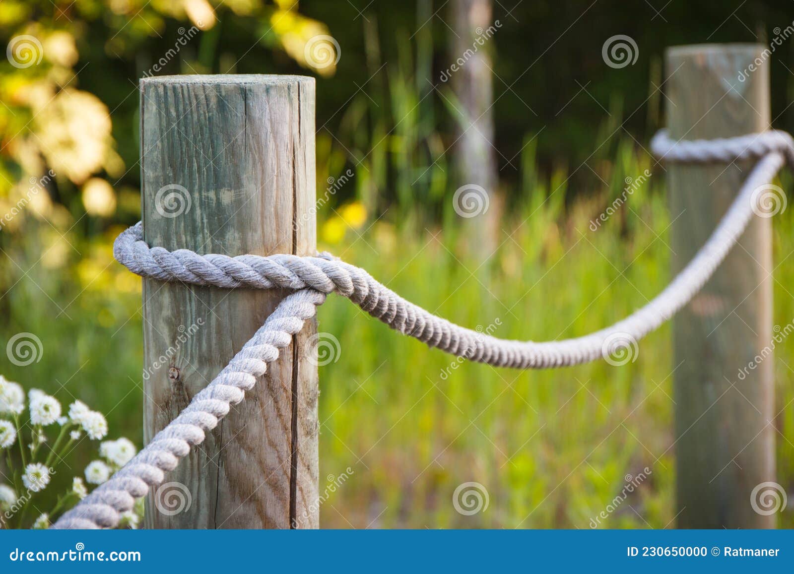 Fence Made of Rope and Wooden Pole in Park Stock Photo - Image of ...