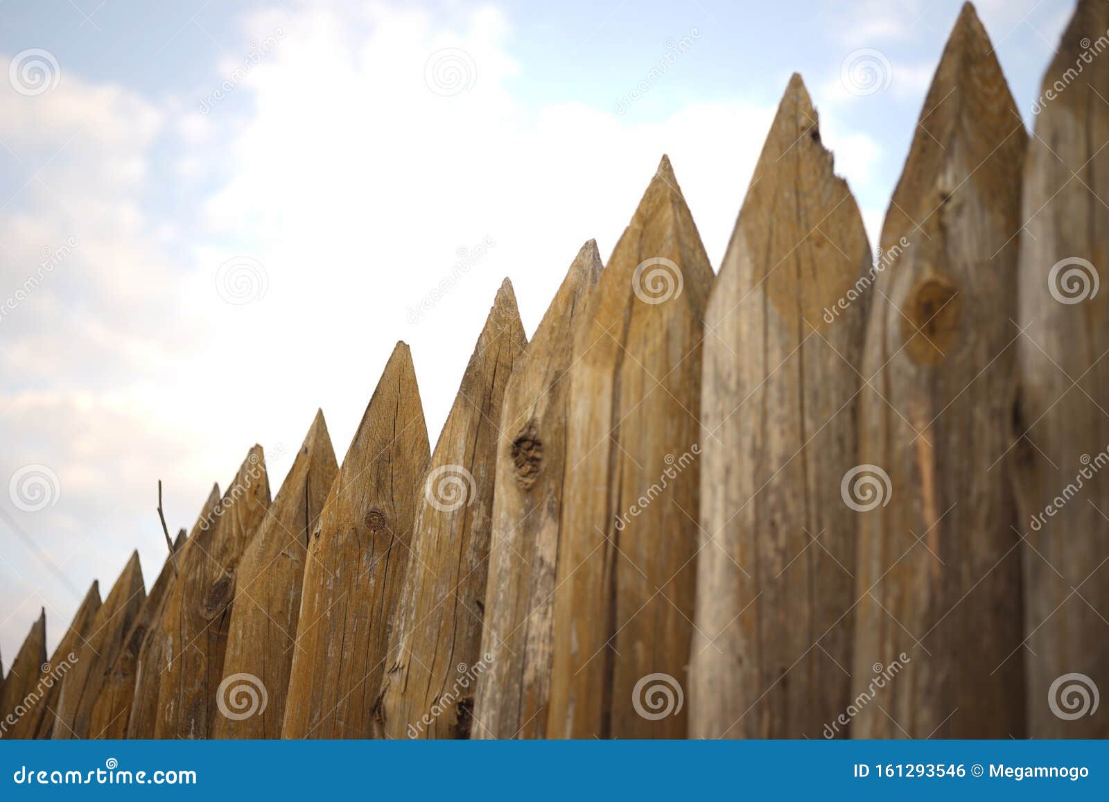 Fence Made of Sharp Wooden Stakes Under Blue Sky Stock Photo - Image of ...
