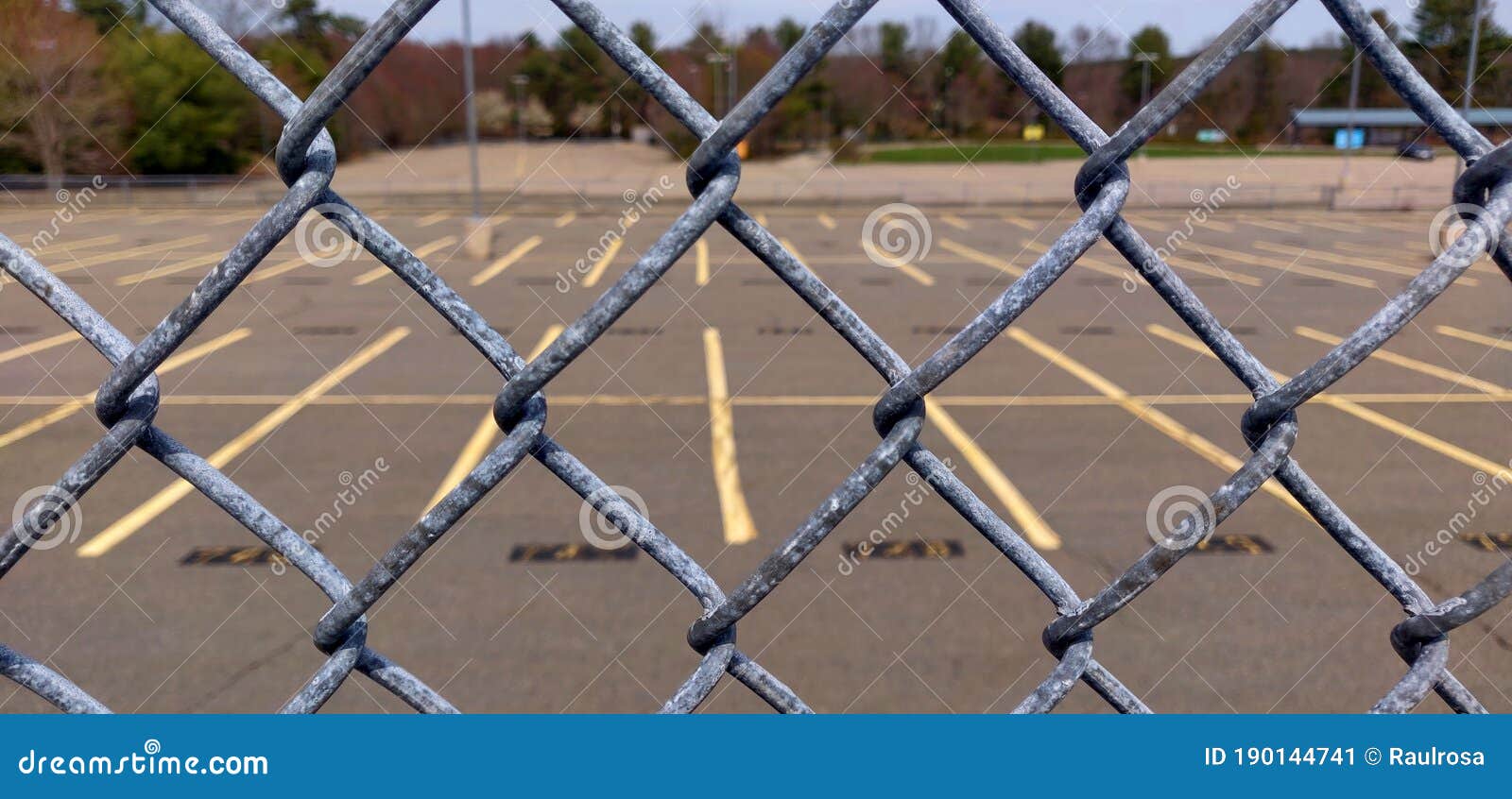 Fence by parking lot stock image. Image of patterns - 190144741