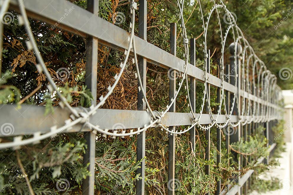 Fence Protected Object with Barbed Wire. Small GRIP Stock Image - Image ...