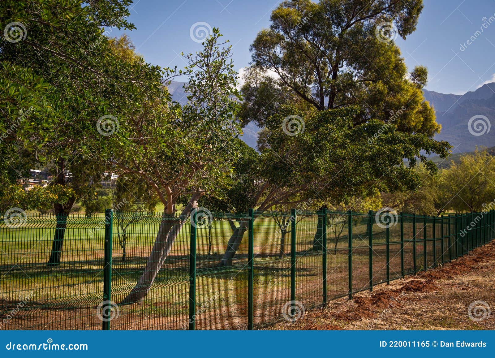 Fence Protoecting a Golf Course Stock Image - Image of scenery, fence ...