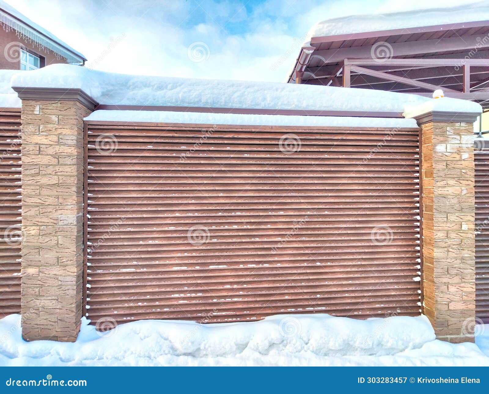 A Fence Section with Metal or Wood Planks, Blinds and Brick Columns in ...