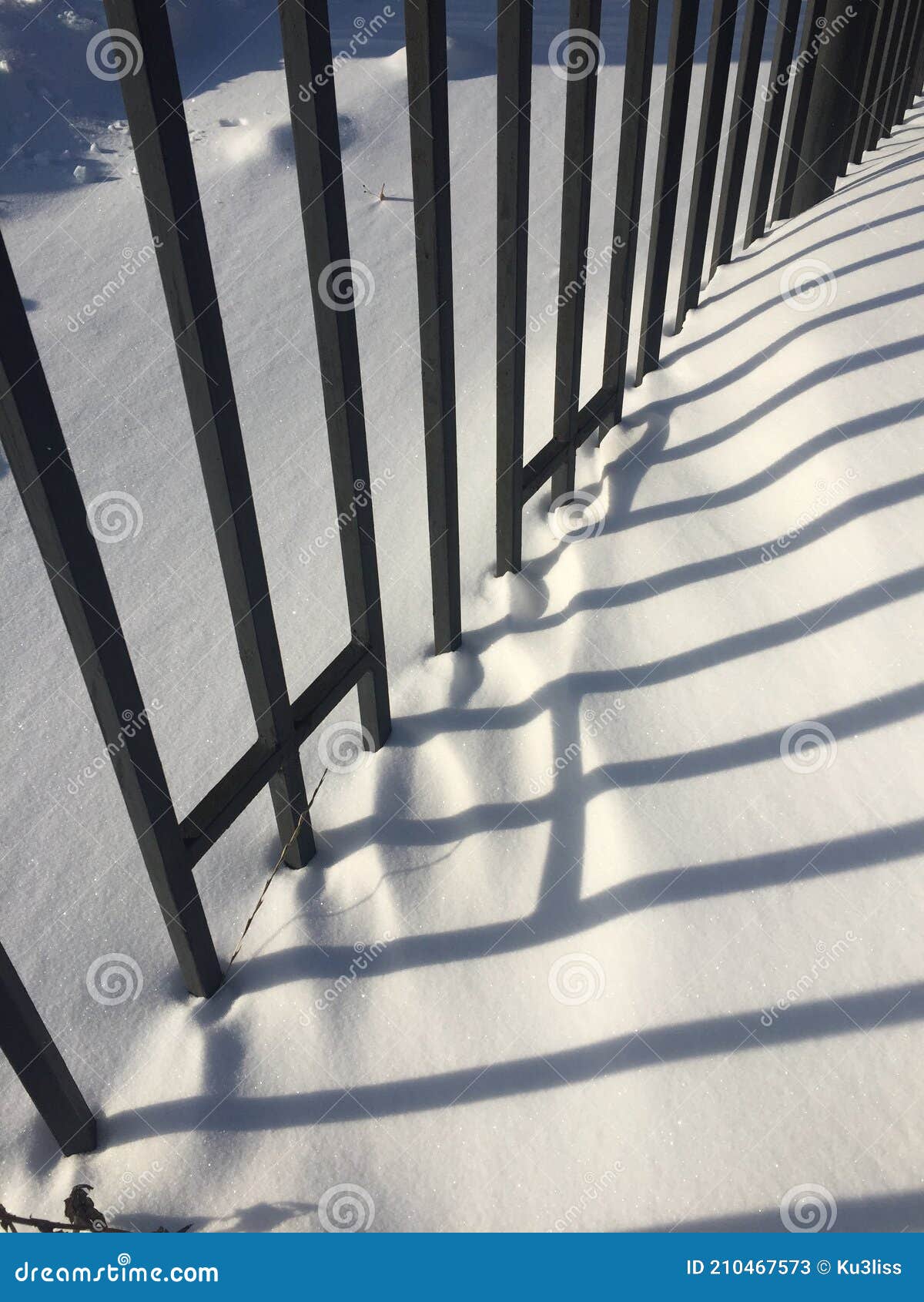 A Fence and the Shadow of the Fence on the Snow on a Sunny Day ...