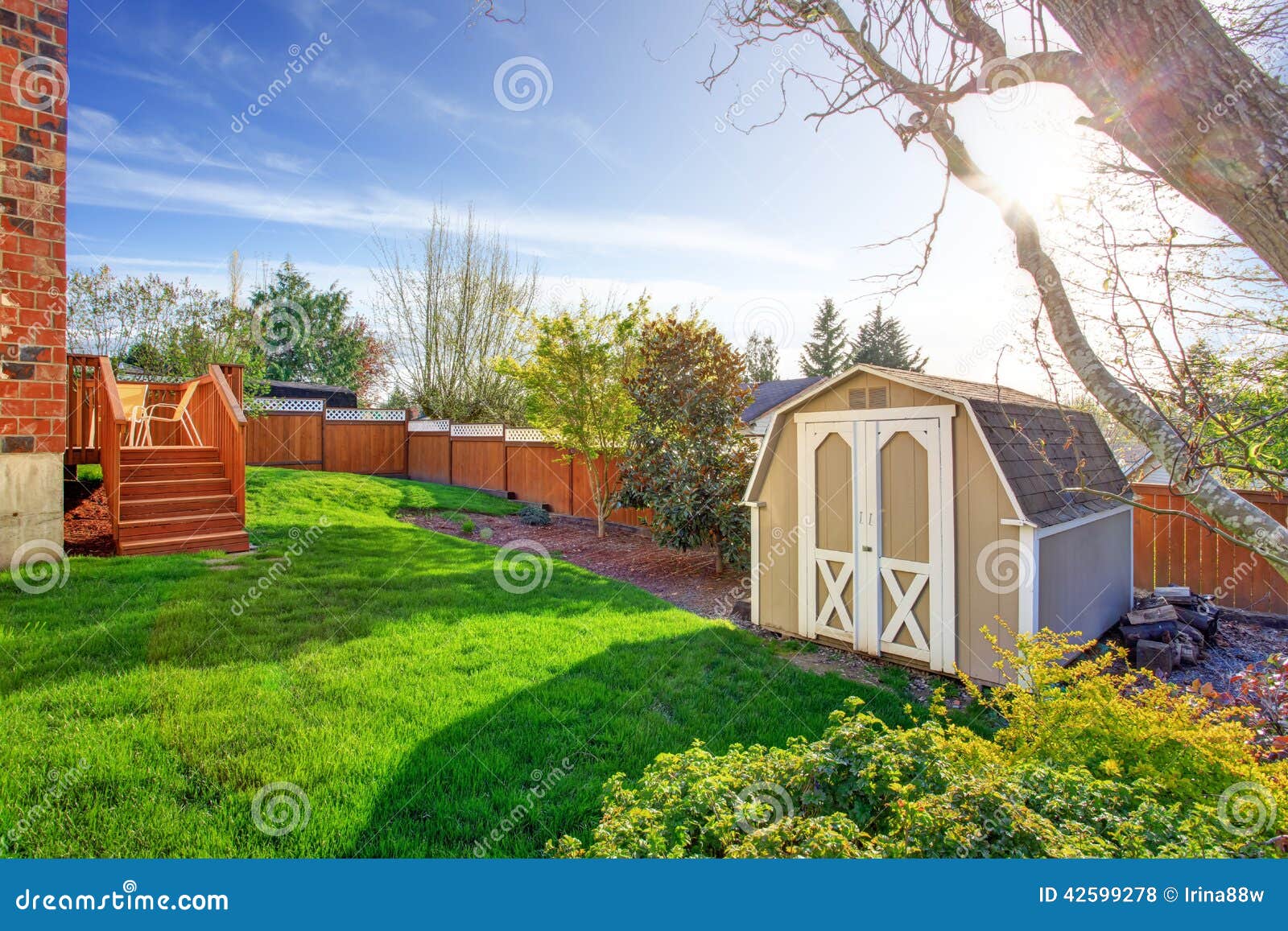 Fenced Backyard with Small Shed Stock Photo - Image of green, fenced ...
