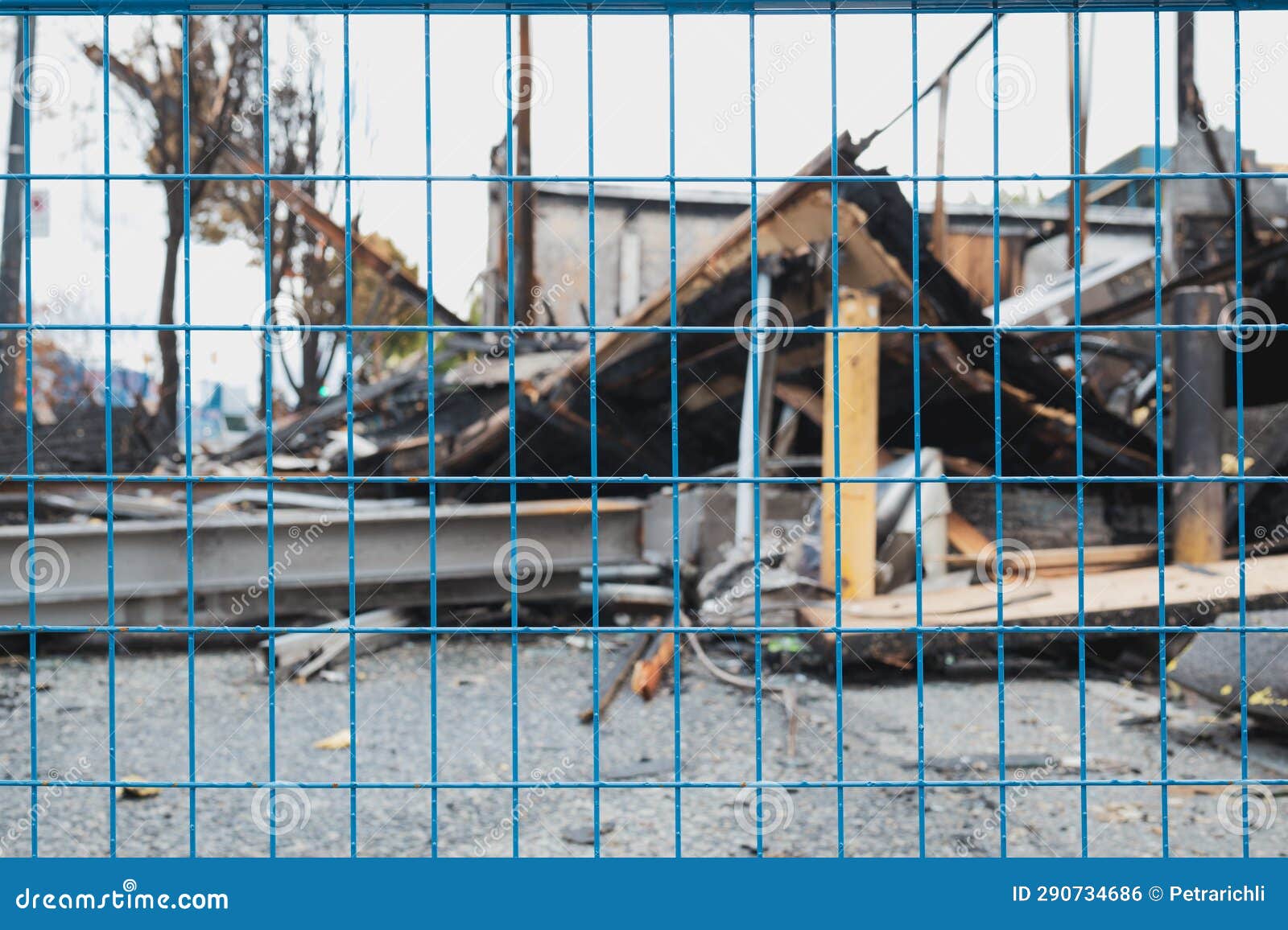 Abstract Burned Building Behind Construction Fence. Stock Photo - Image ...