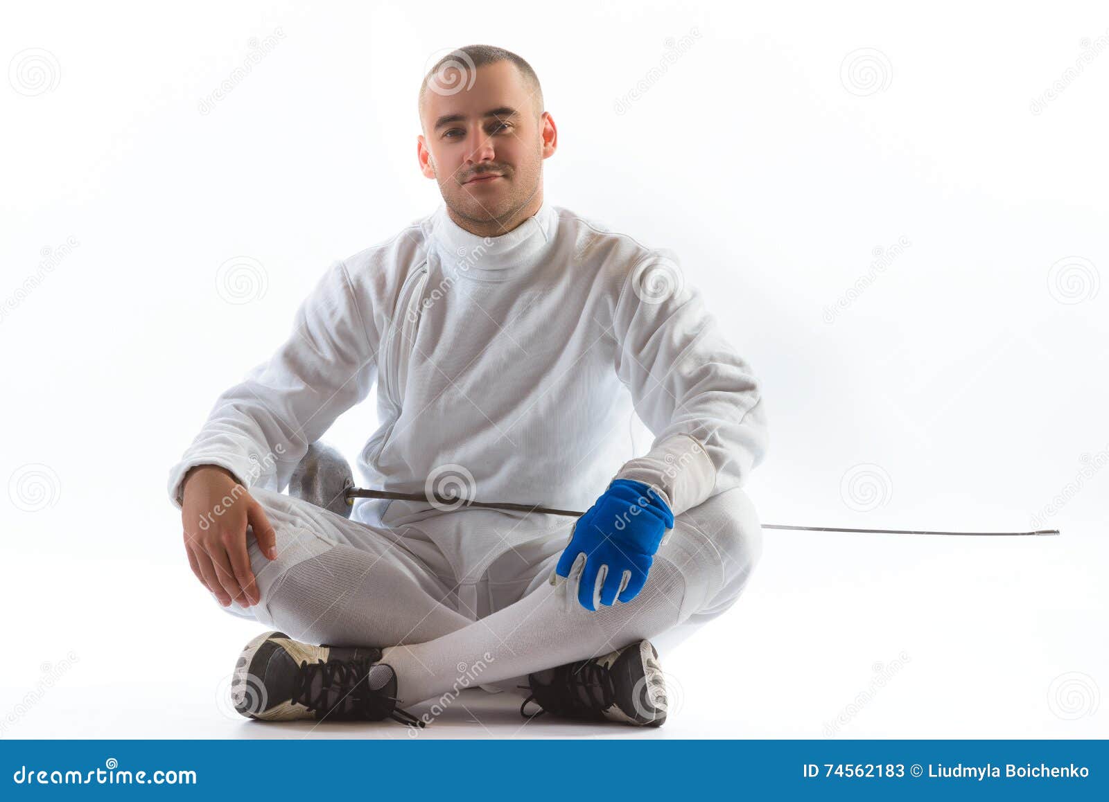 Fencing Athlete Posing With A Sword Or Epee On Gray Background Stock ...
