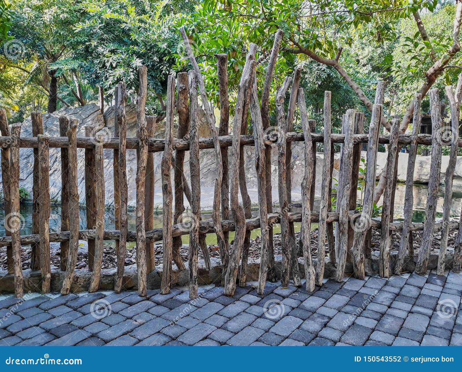 Fencing with dry wood logs stock photo. Image of delimit - 150543552