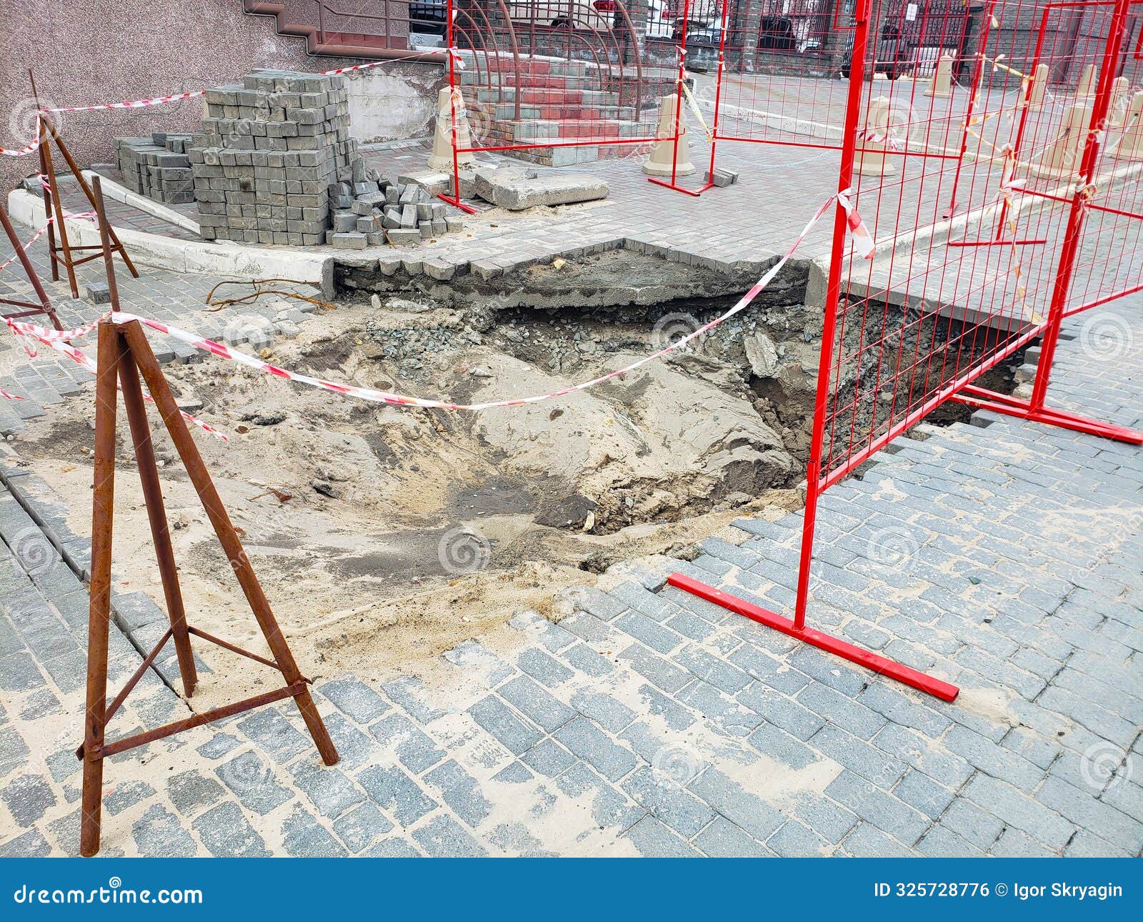 Fencing in Front of a Sinkhole in the Sidewalk. the Paving Slabs are ...