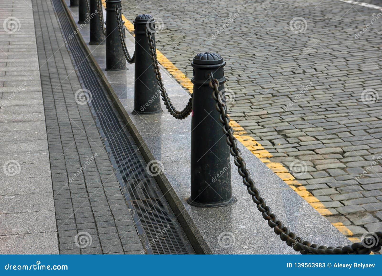 Fencing of Sidewalk in Form of Black Cast Iron Posts with Iron Chains ...