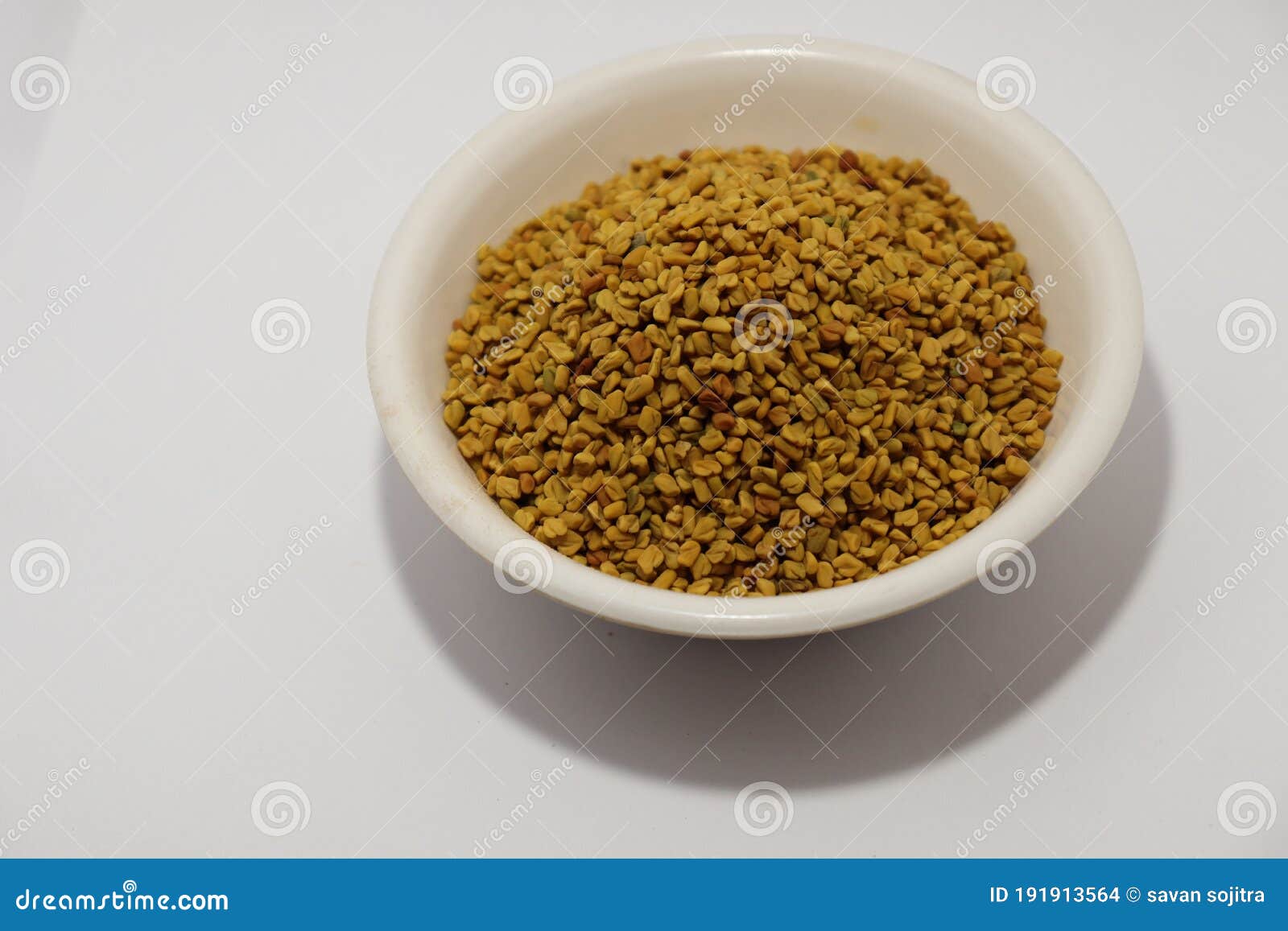 Fenugreek Methi Seed on the Bowl.in White Background. Stock Photo ...