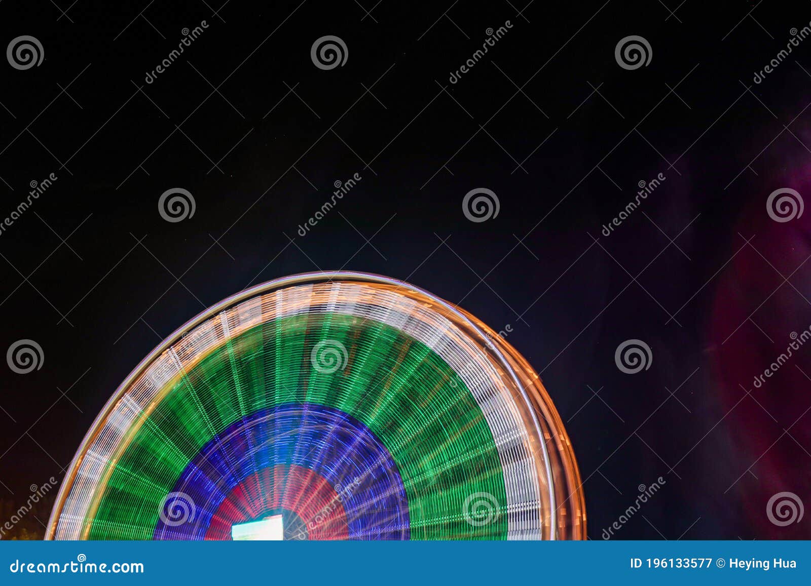 Ferries Wheel Rotating at Night with Lights at Amusement Park. Stock ...