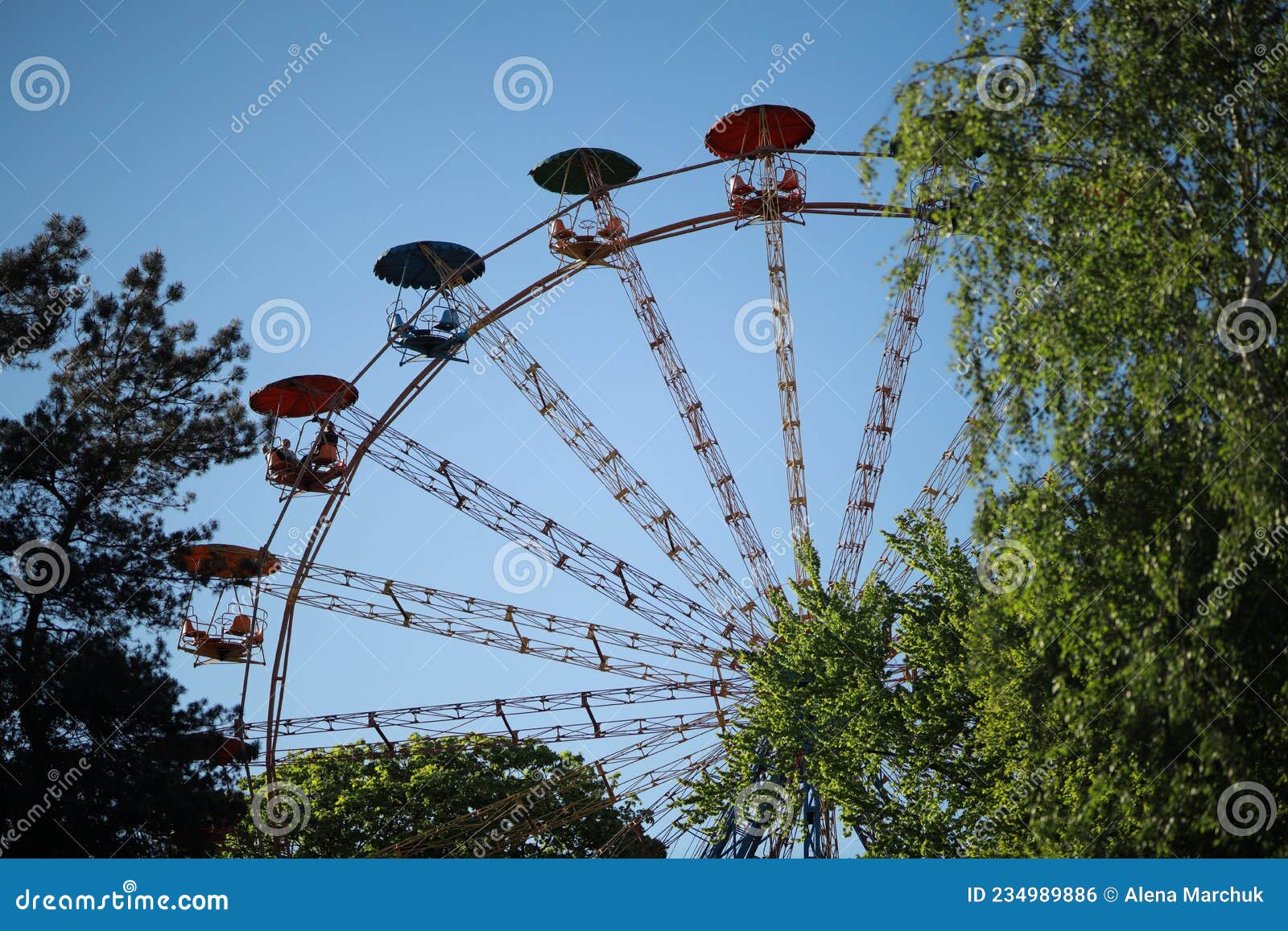 Ferris Wheel on a Background of Blue Sky. Amusement Park Stock Photo ...