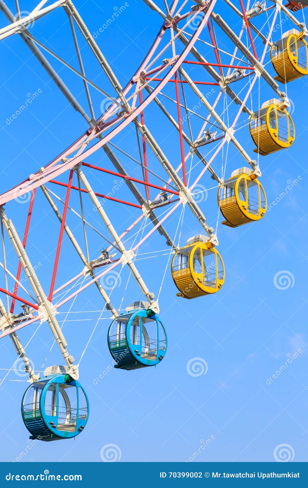 Ferris Wheel with Colorful Baskets on Blue Sky Background Stock Photo ...