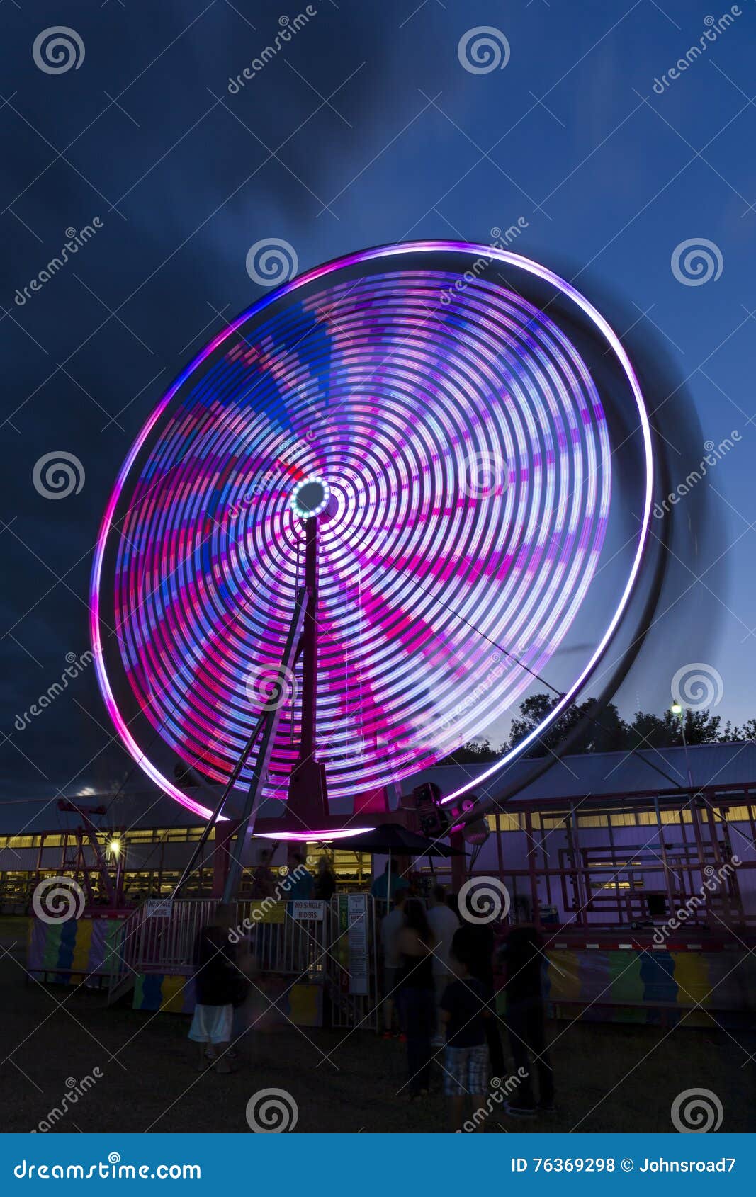 Ferris Wheel in Motion stock photo. Image of entertainment - 76369298