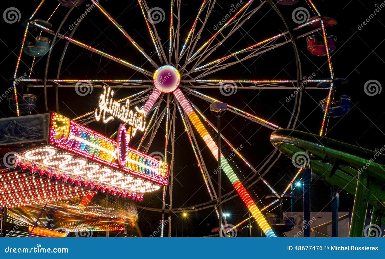 Ferris Wheel and Roundabout Stock Photo - Image of amusement, loop ...