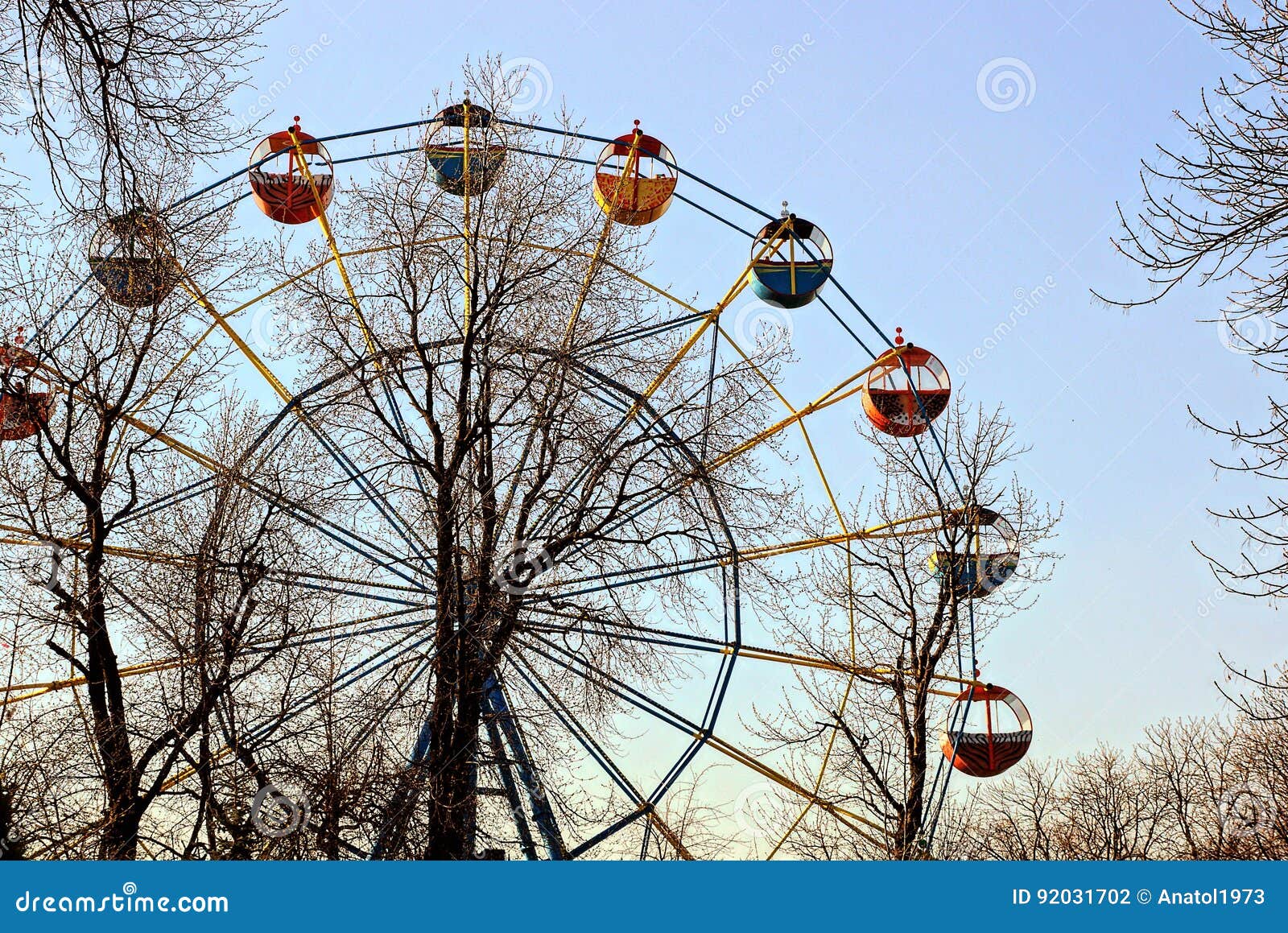 Ferris Wheel in a Spring Park among Trees Stock Photo - Image of booth ...