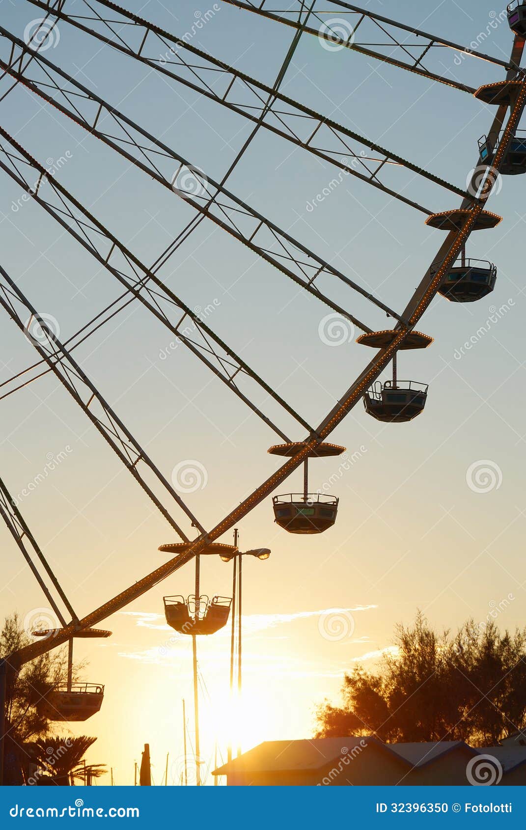 Ferris wheel at sunrise stock photo. Image of fairground - 32396350