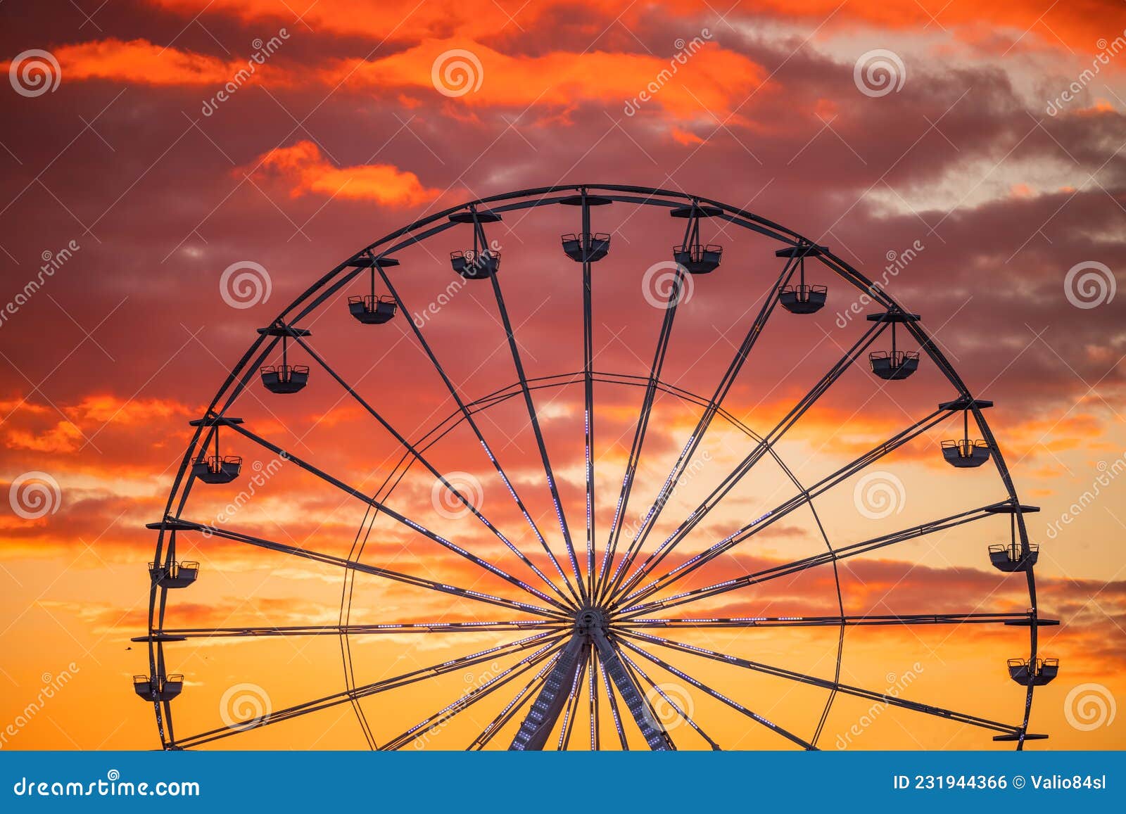 Ferris Wheel at sunset sky stock photo. Image of ferris - 231944366
